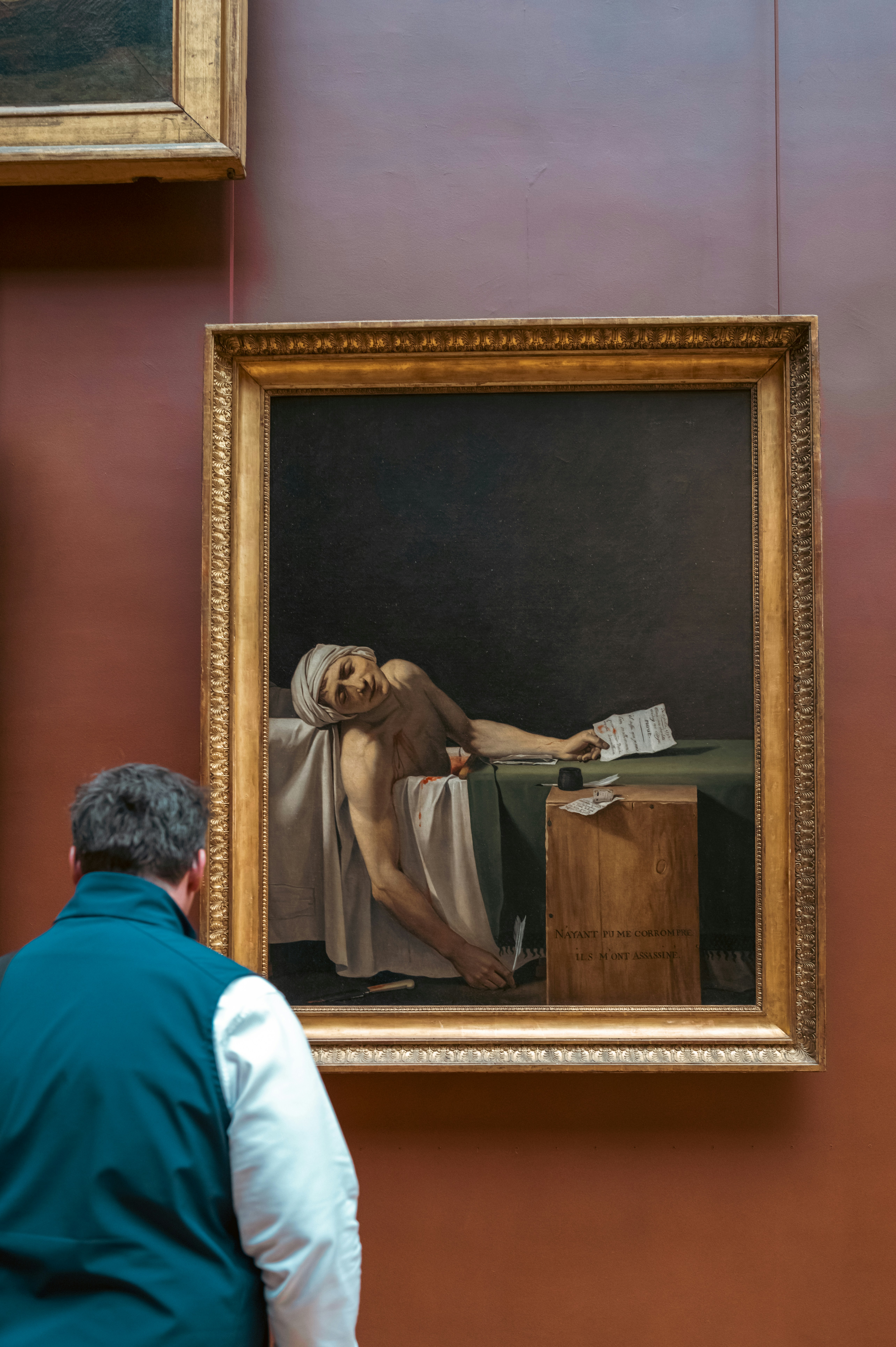 A man views jacques-louis david's "the death of marat." photo – Free ...