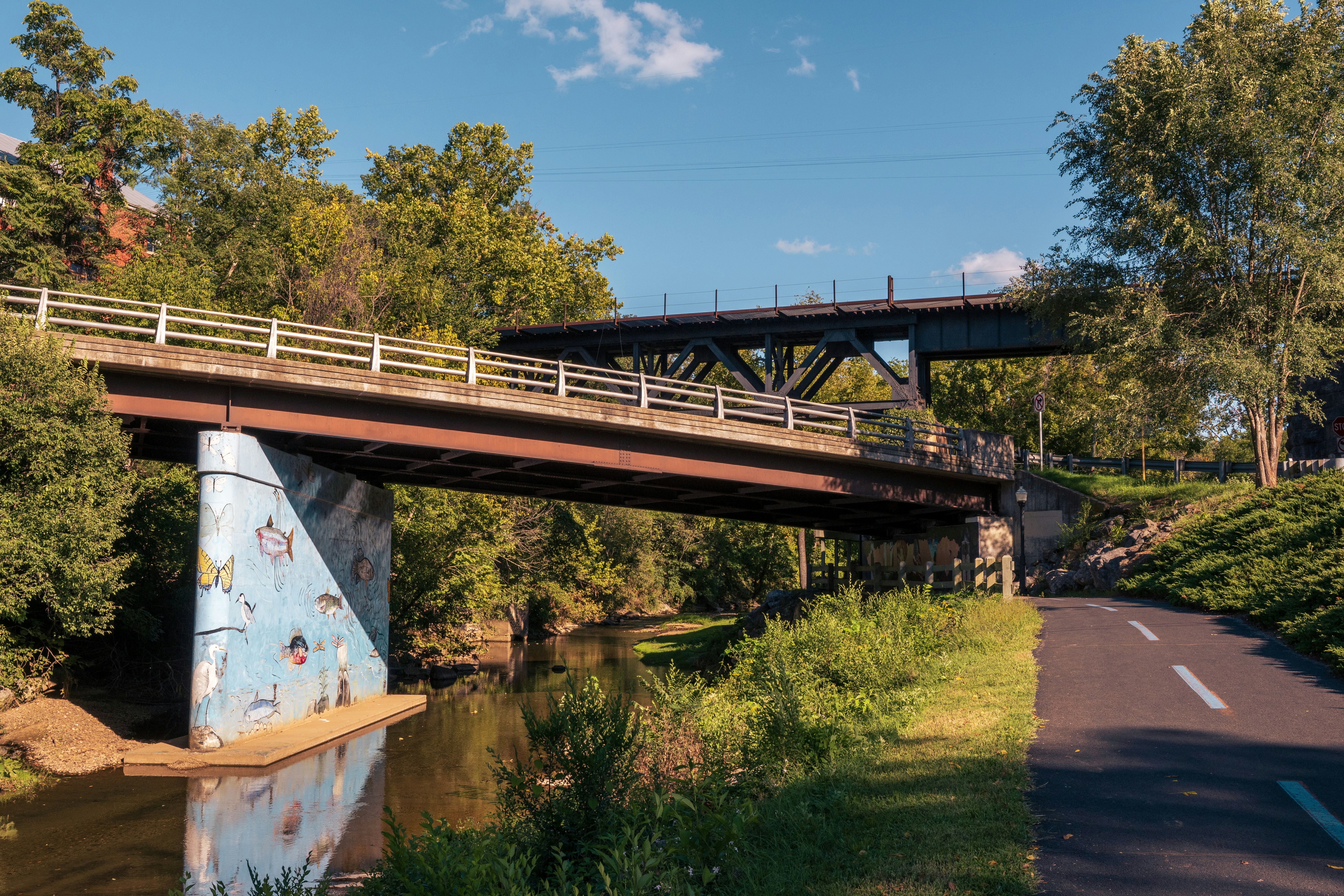 Bridges over a calm river on a sunny day.
