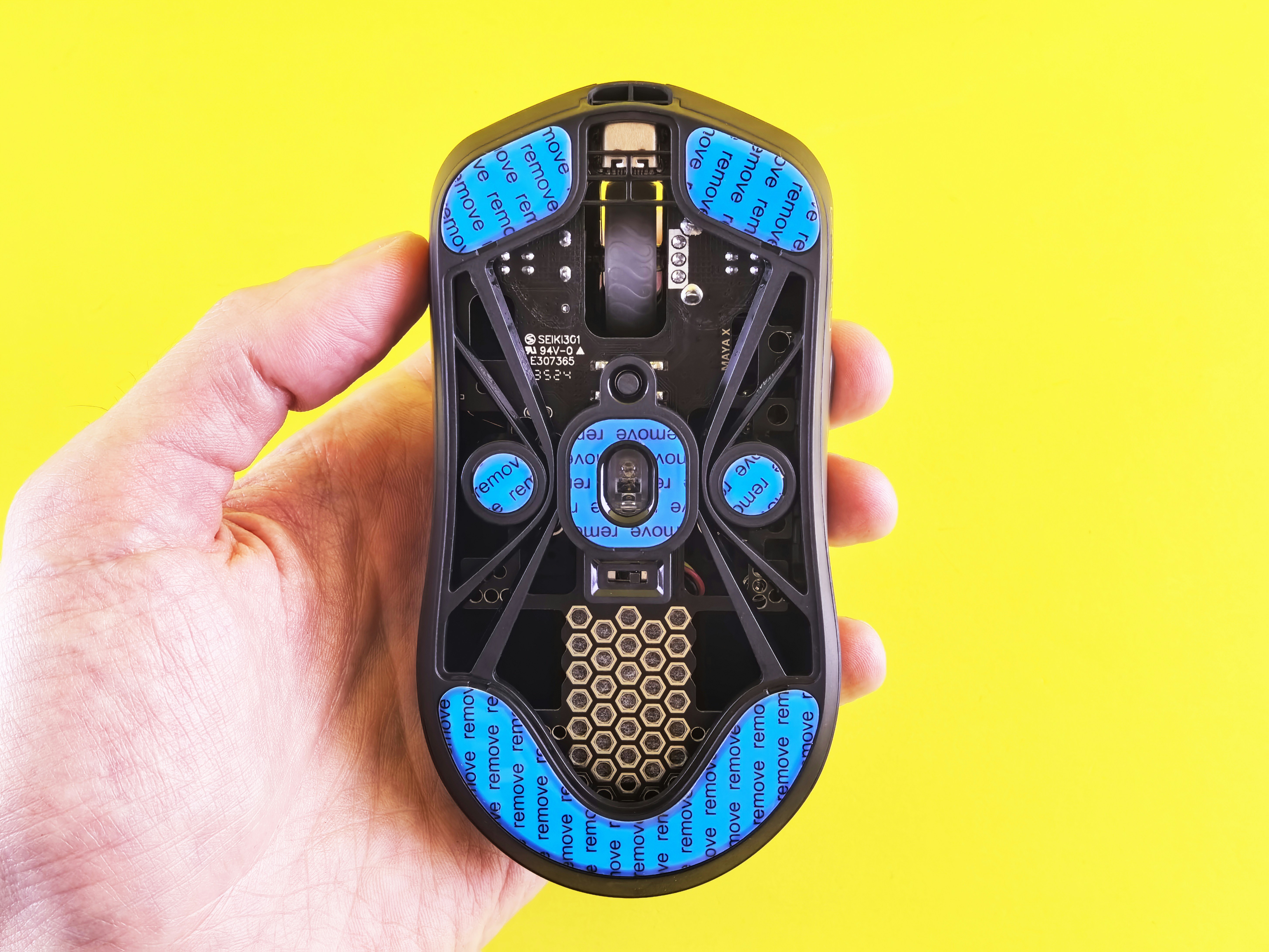 The bottom of a gaming mouse is shown.