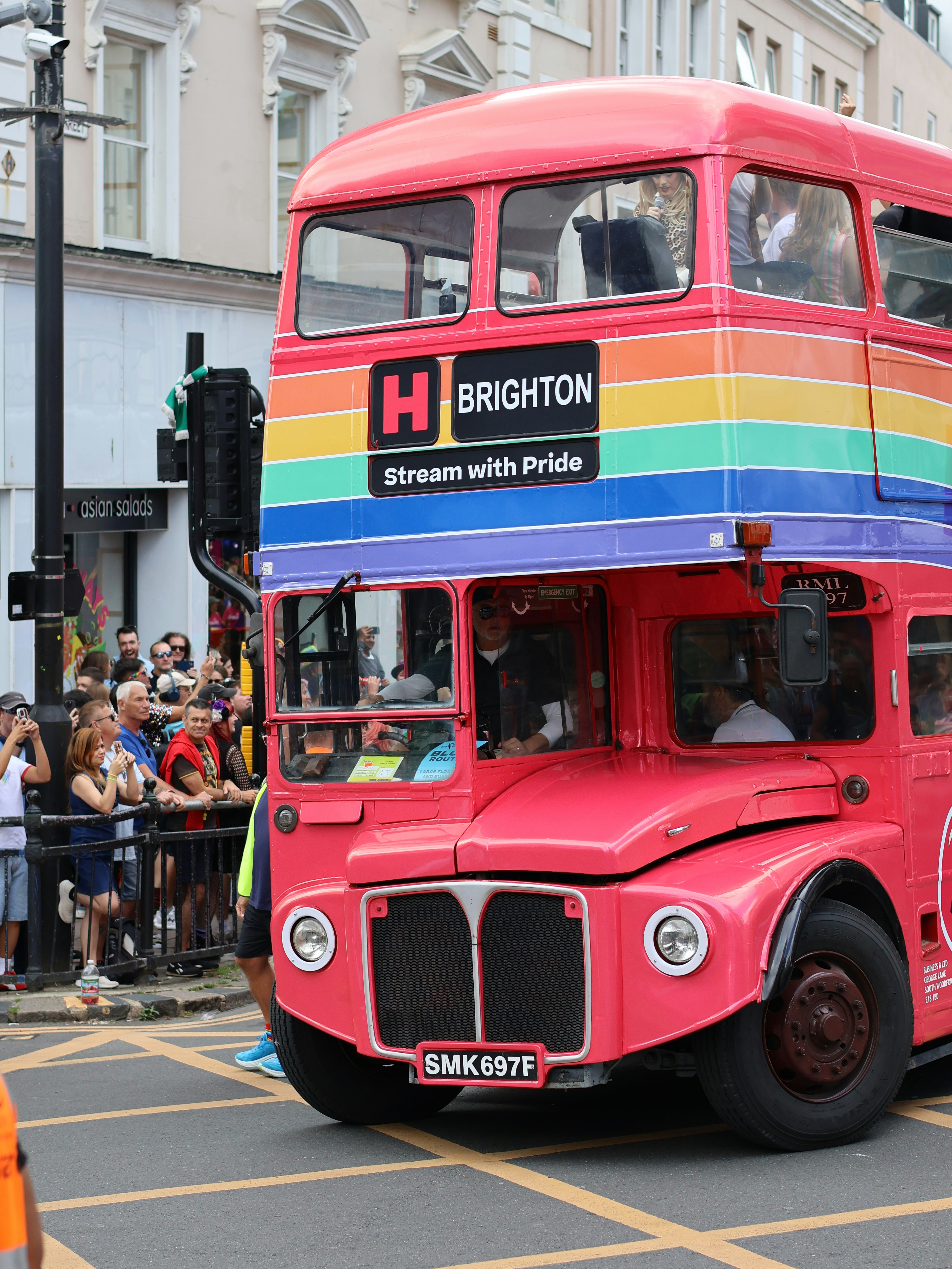 A pride-themed bus parades through the city streets. photo – Free Man ...