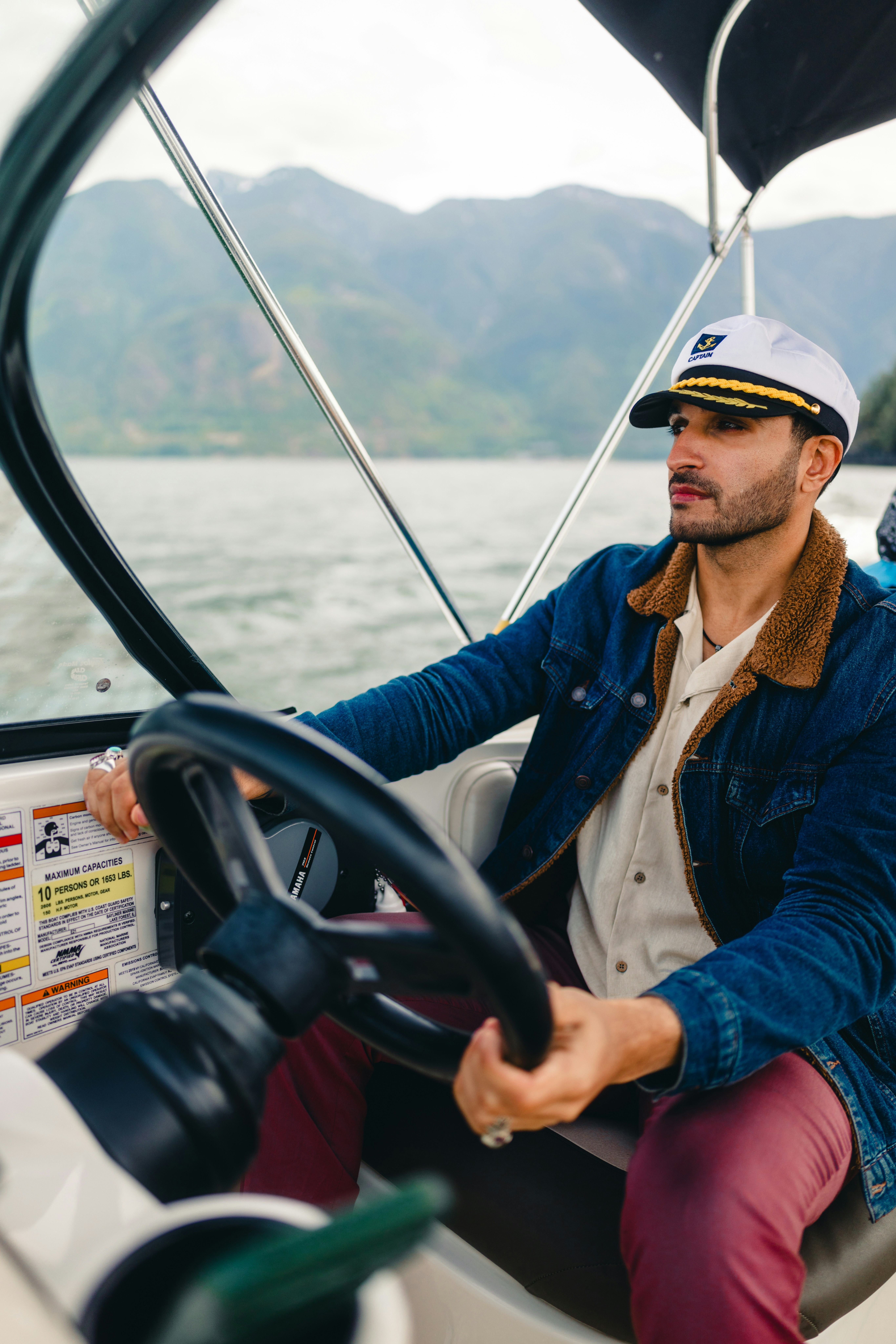 Captain at the Wheel: A Navigator's Moment on the Open Water