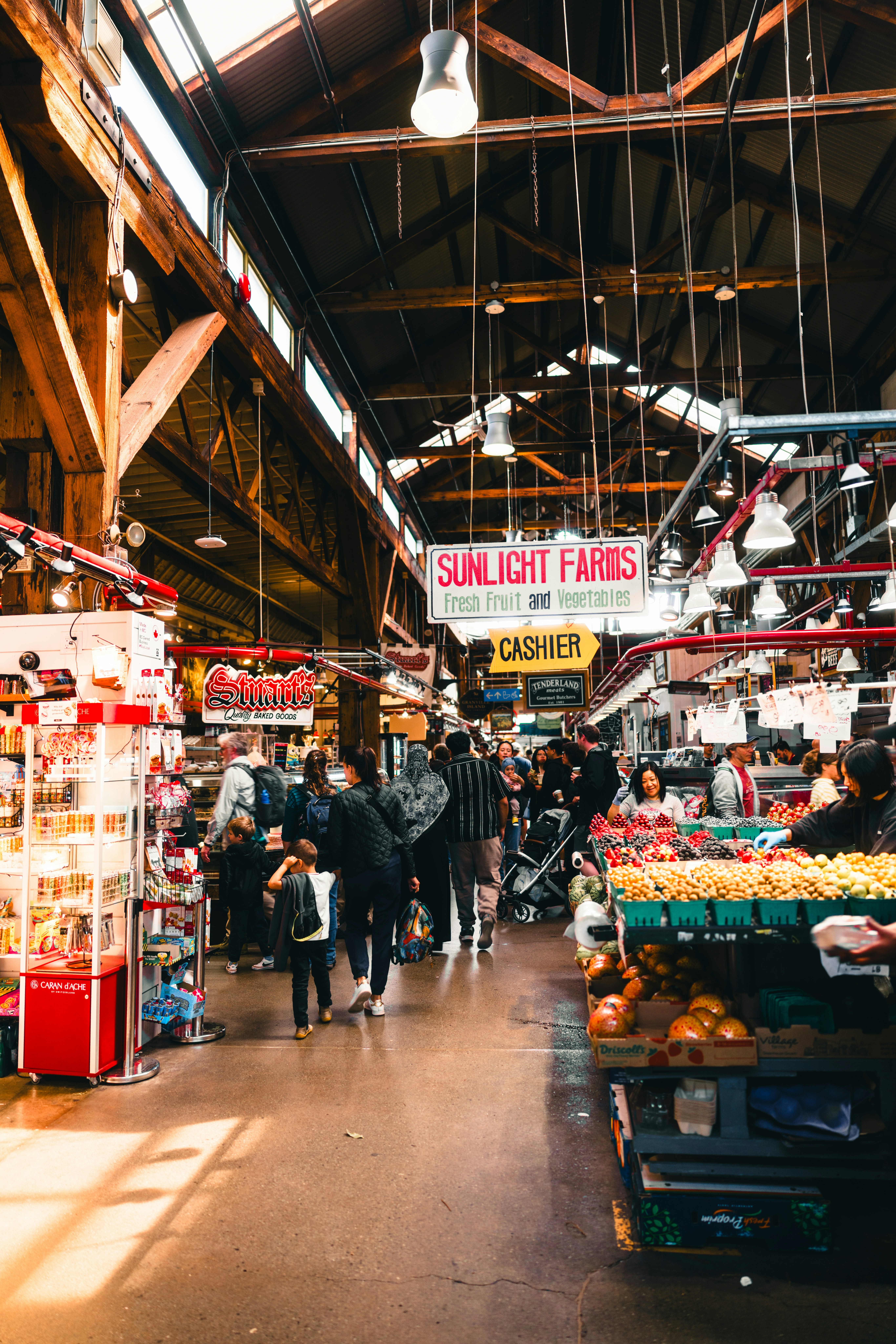I miss Vancouver so much | People browse inside a bustling market.