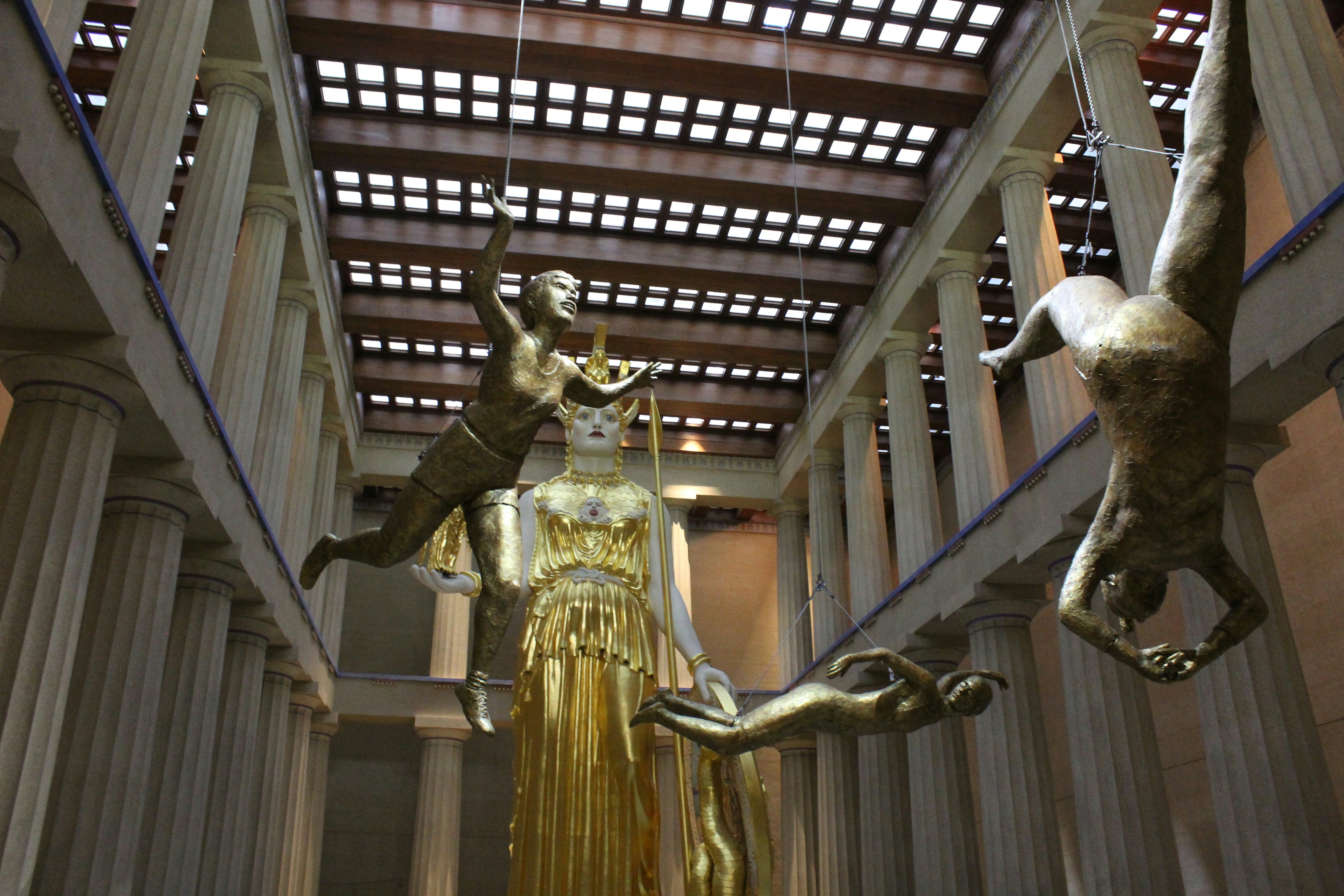 Museumscape of Flight: Golden Figures in a Classical Atrium