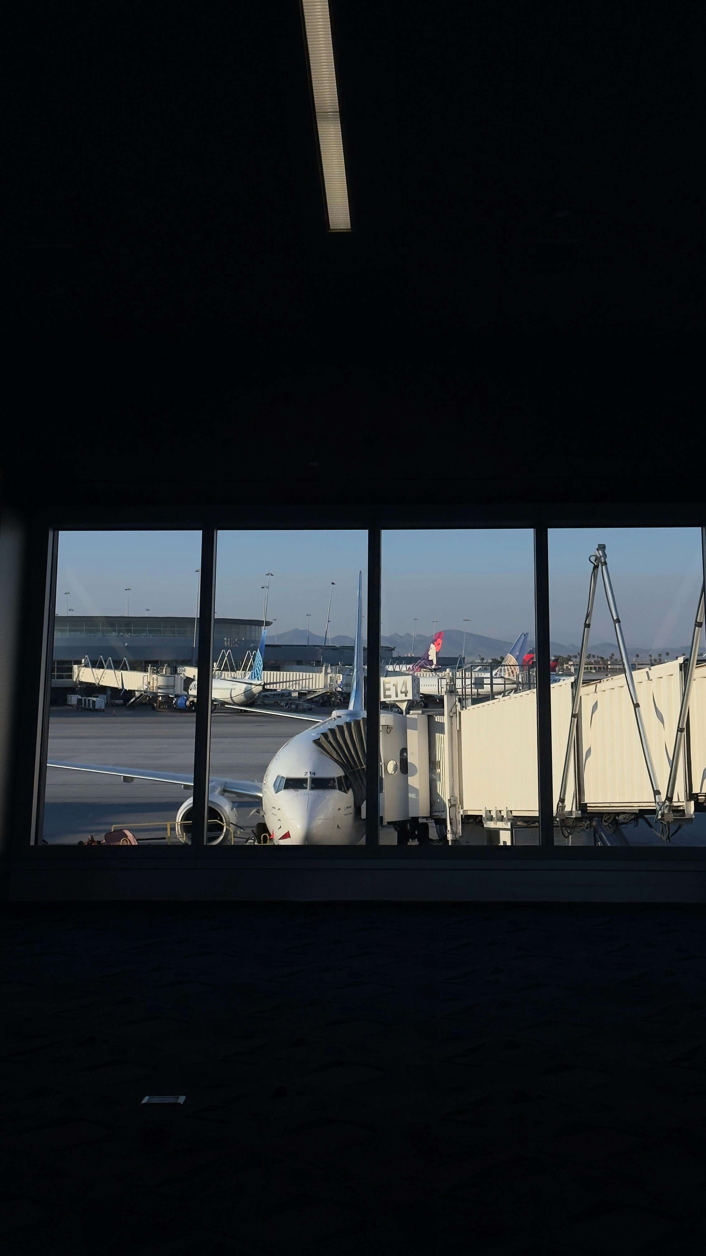 Plane at an airport gate, viewed from inside.