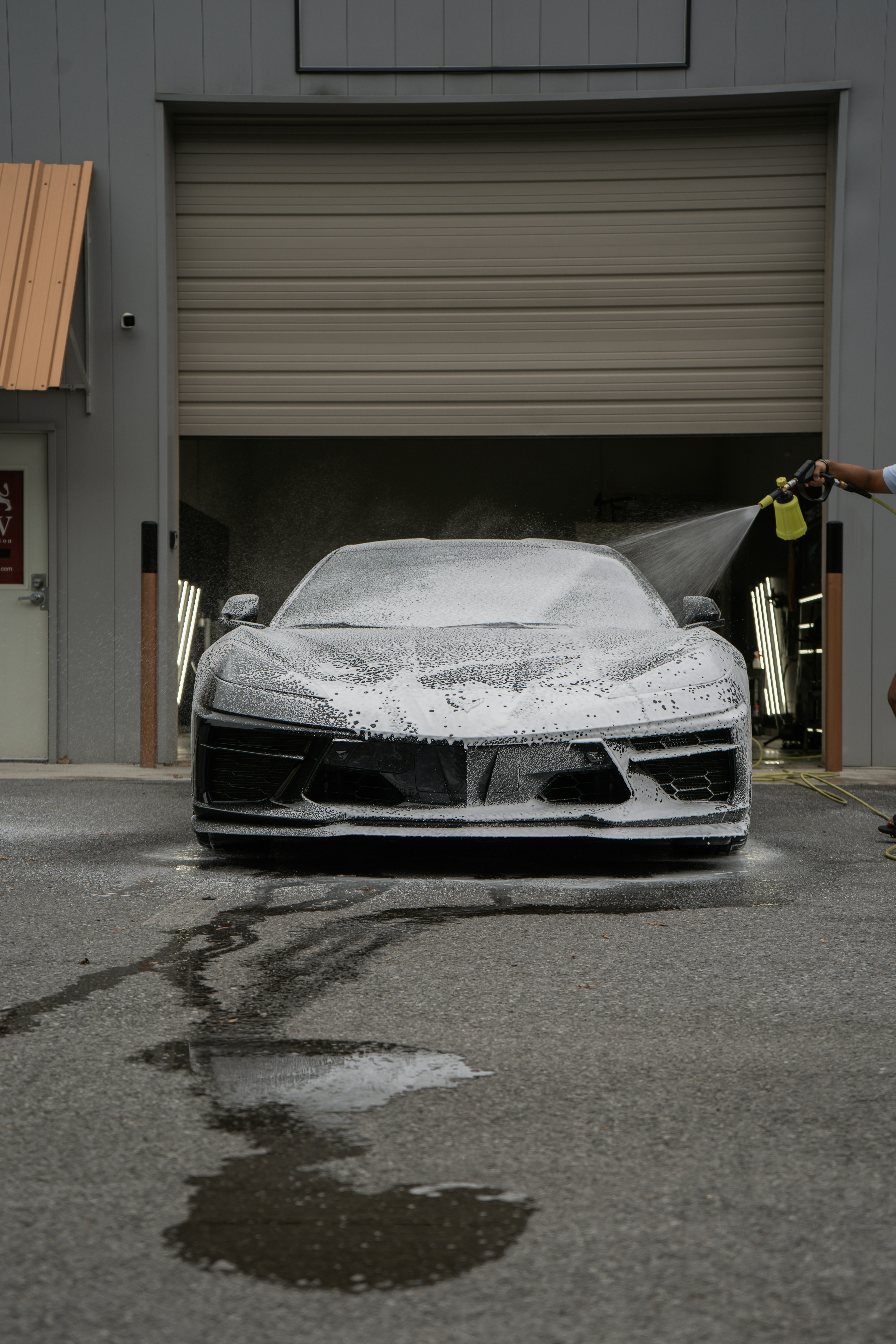Foam-Face Finale: A Sleek Supercar Emerges from the Garage Wash