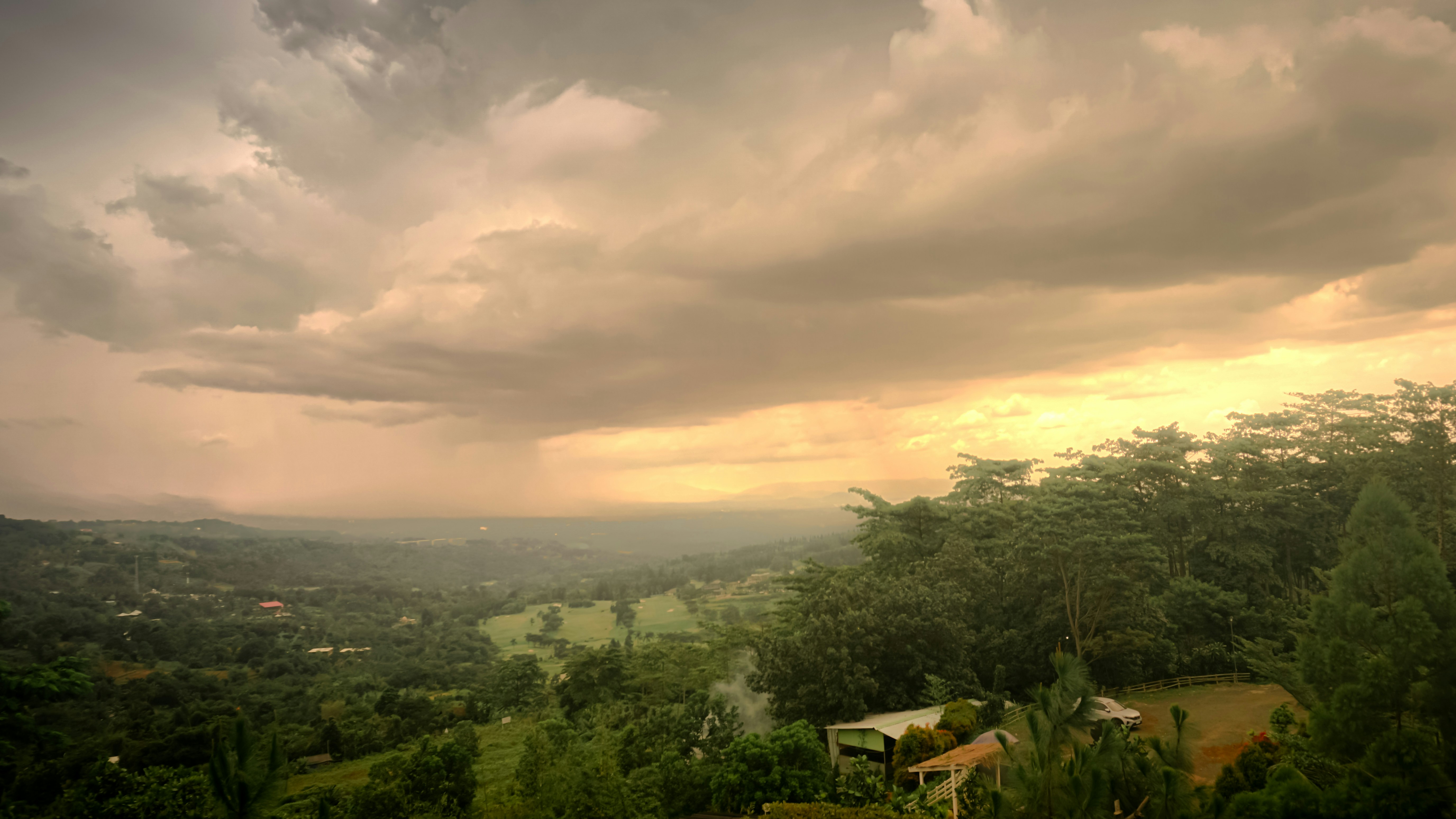 Overcast sky blankets a green valley.