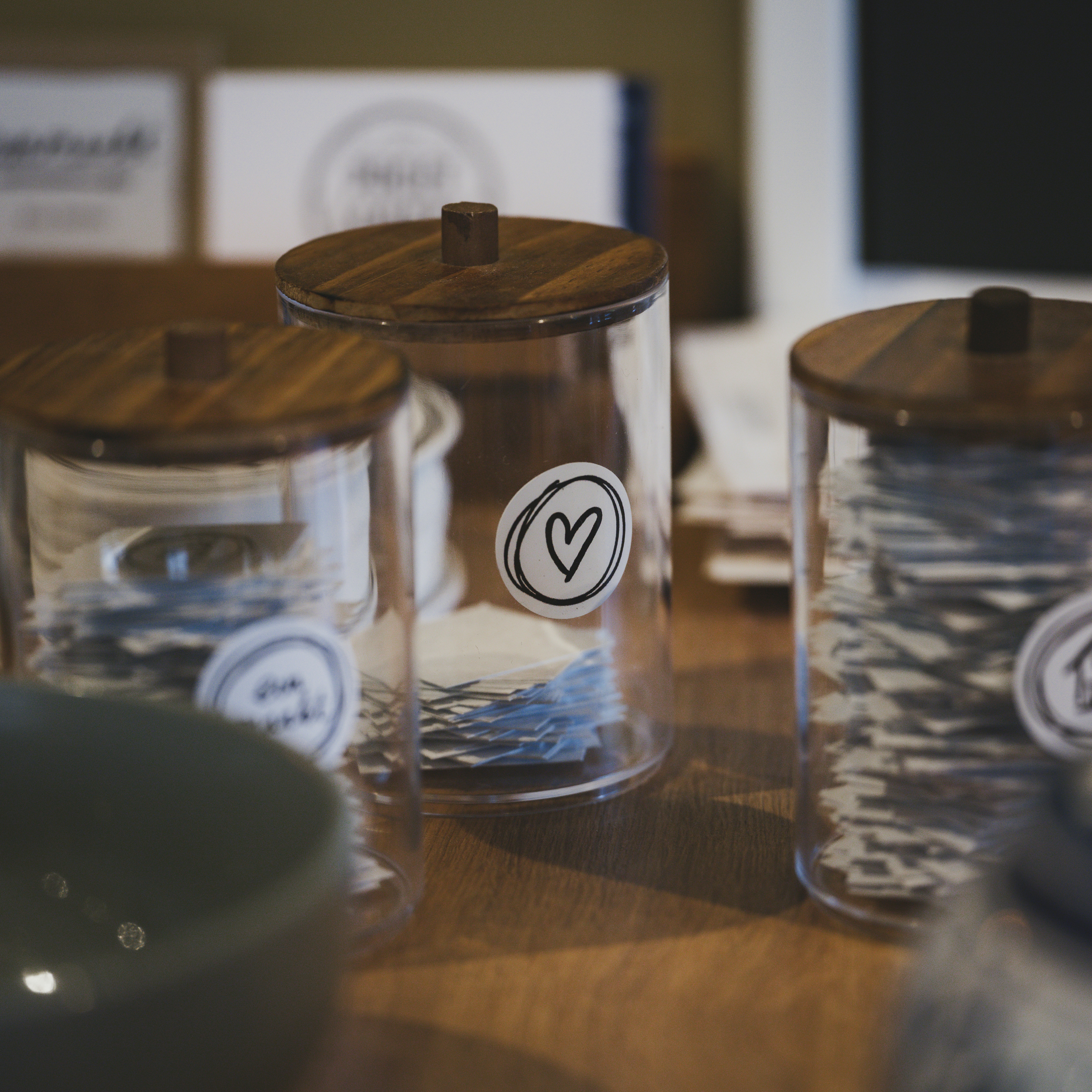 Heart-Sticker Jars on a Warm Wood Table: A Quiet Still-Life Study