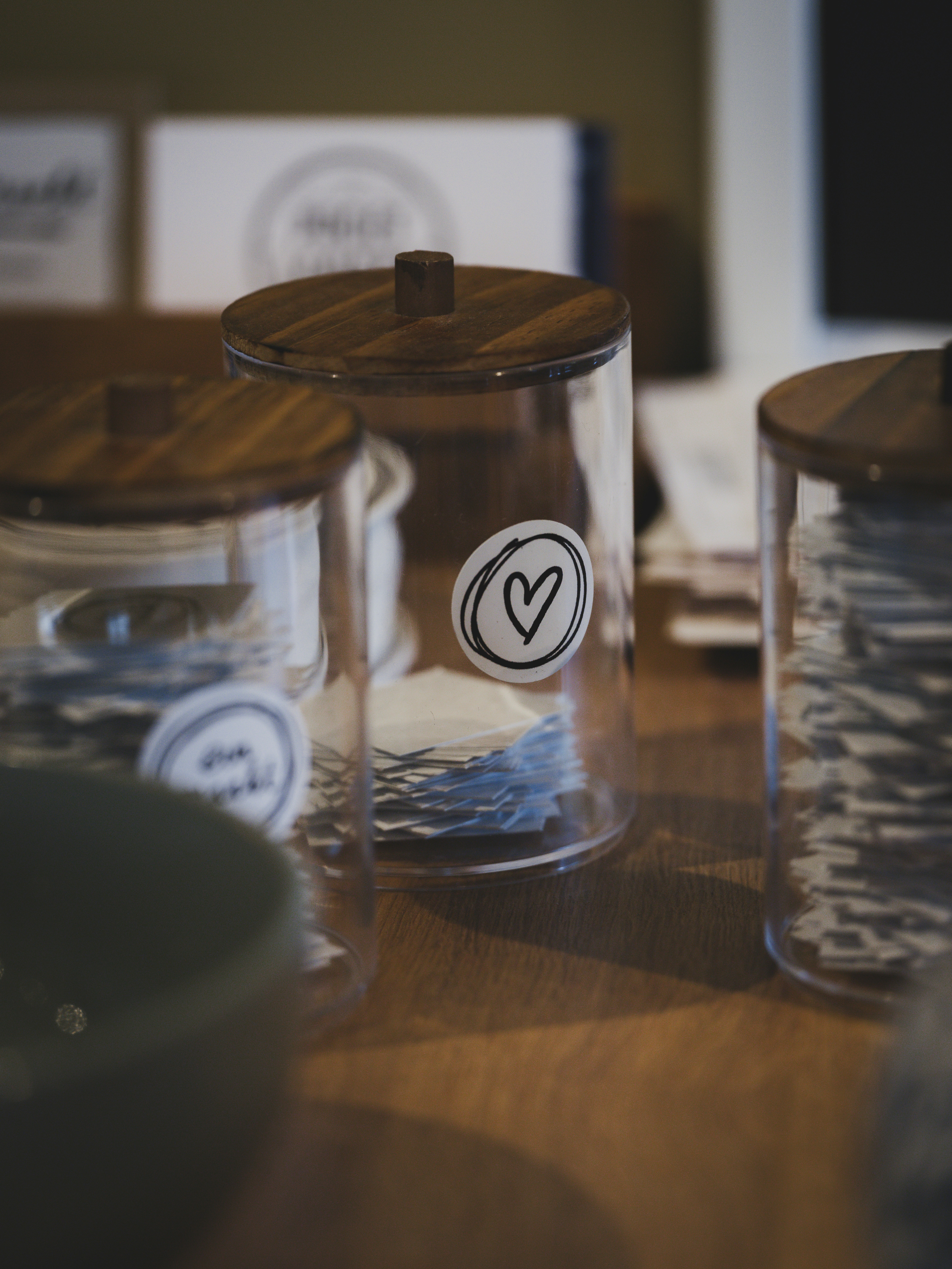 Heart Sticker in Focus: A Cozy Jar Still-Life on a Wooden Counter