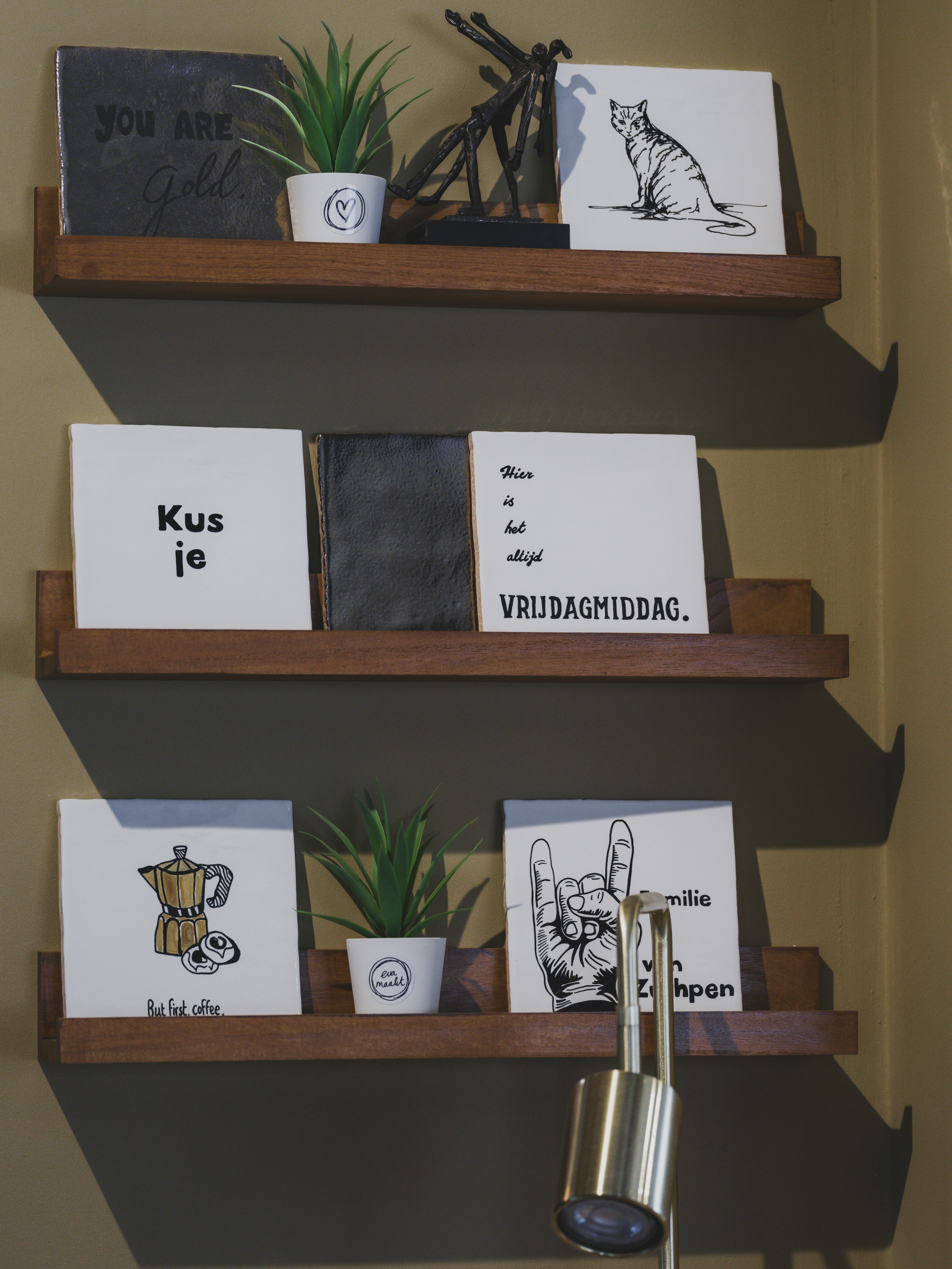 Home Interior | Decorated shelves with tiles and potted plants.