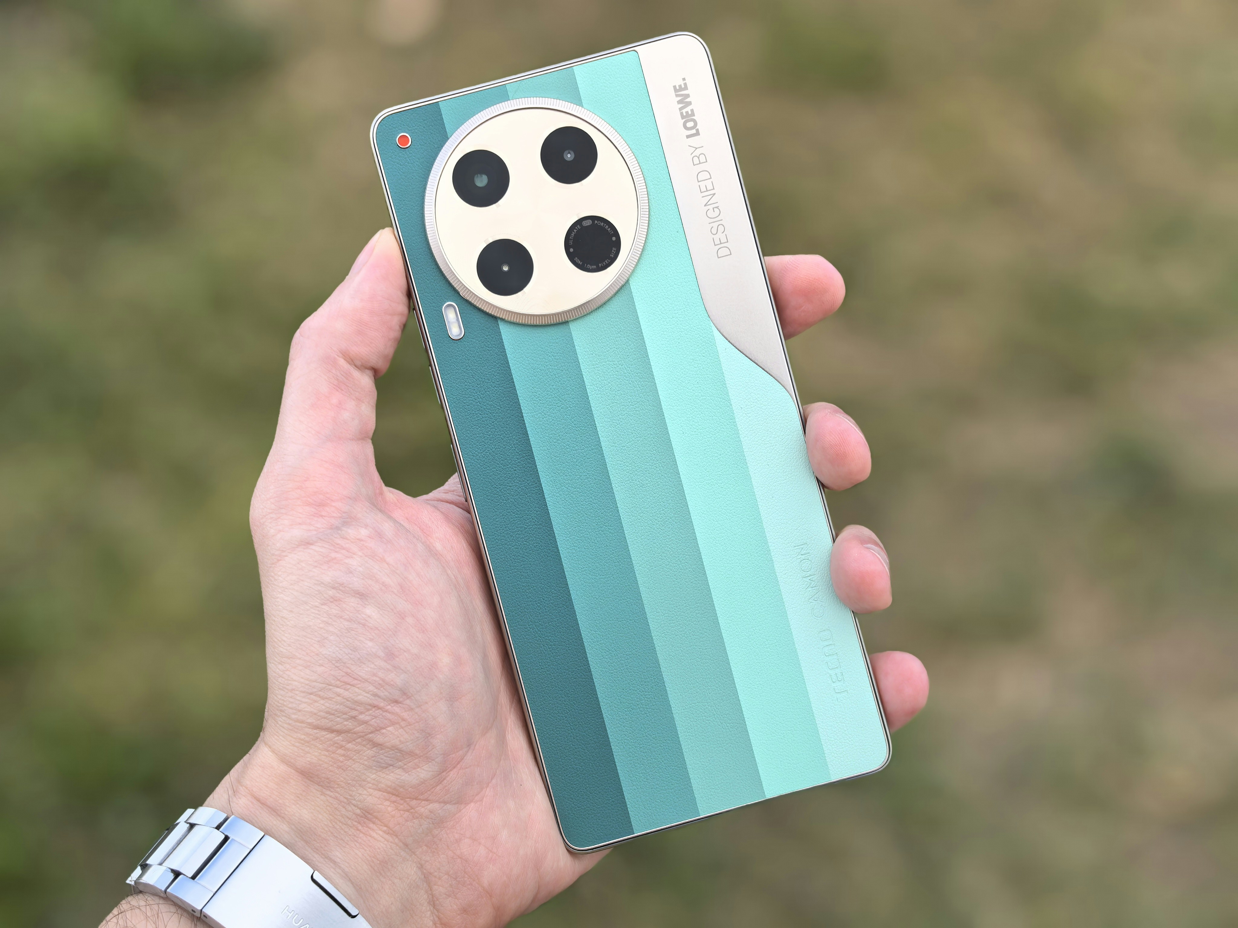 Huawei Pura 70 held in hand, showcasing its sleek gradient design and innovative camera layout.