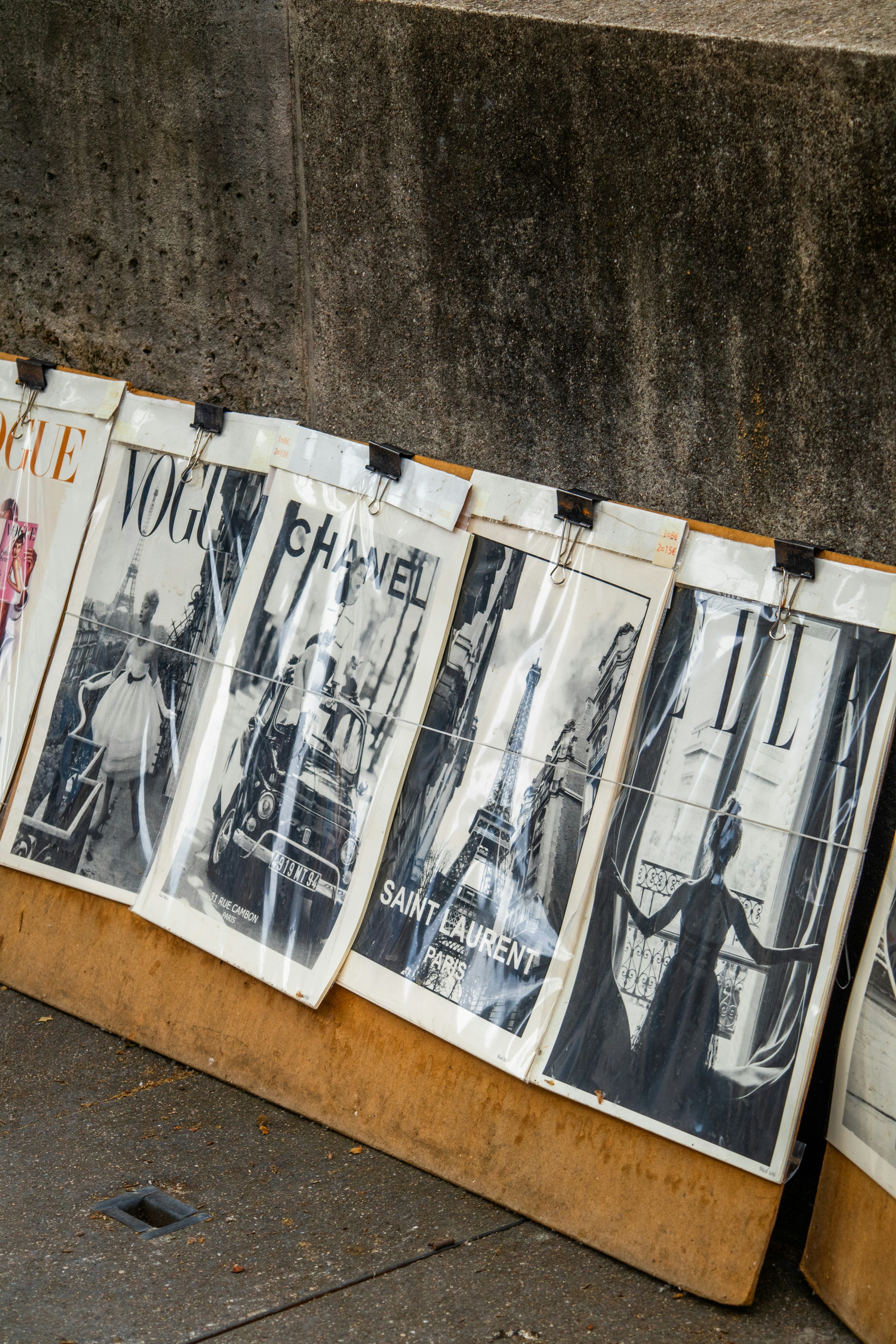 Fashion magazines for sale in an outdoor display.