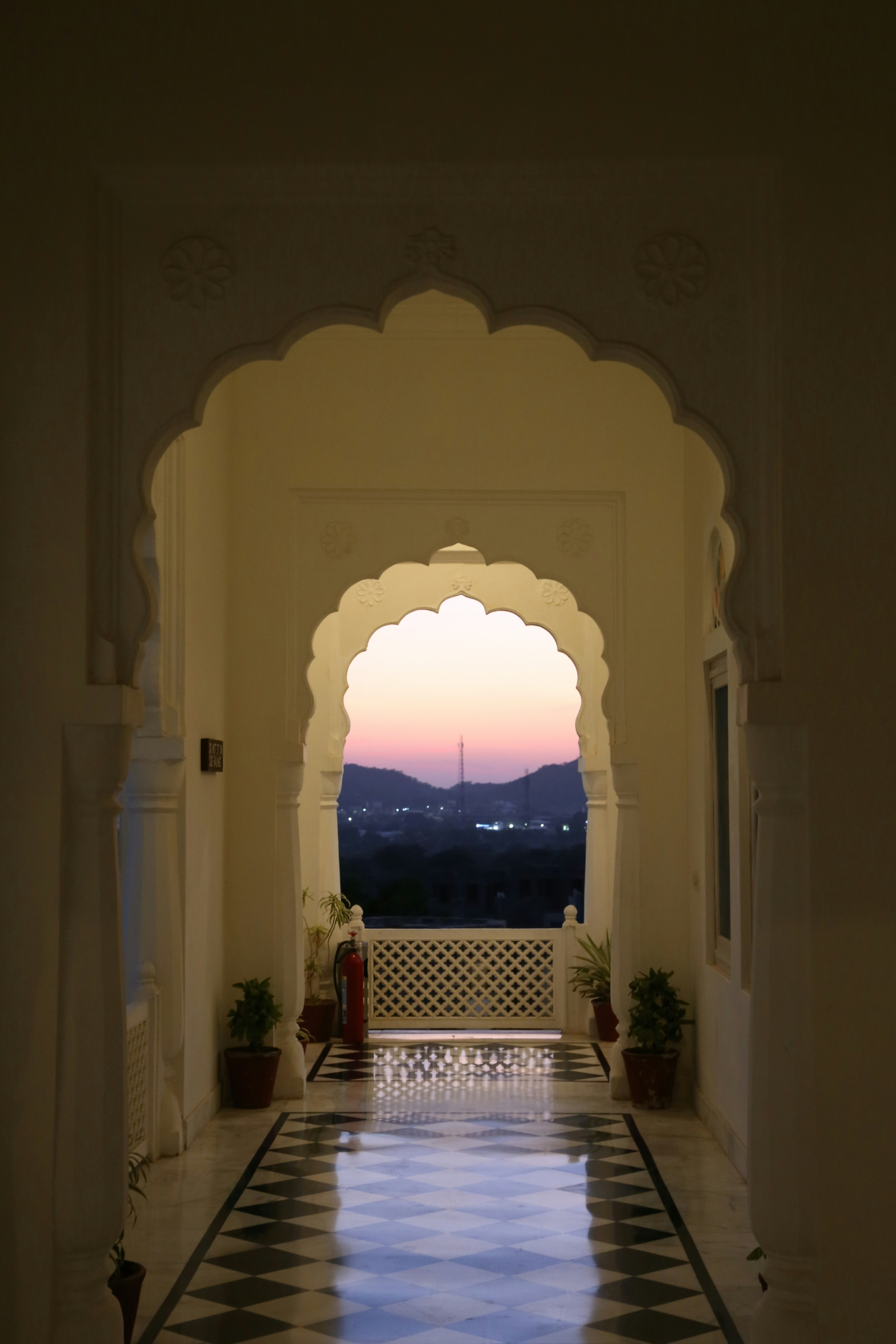 Hallway archway framing a beautiful sunset view.