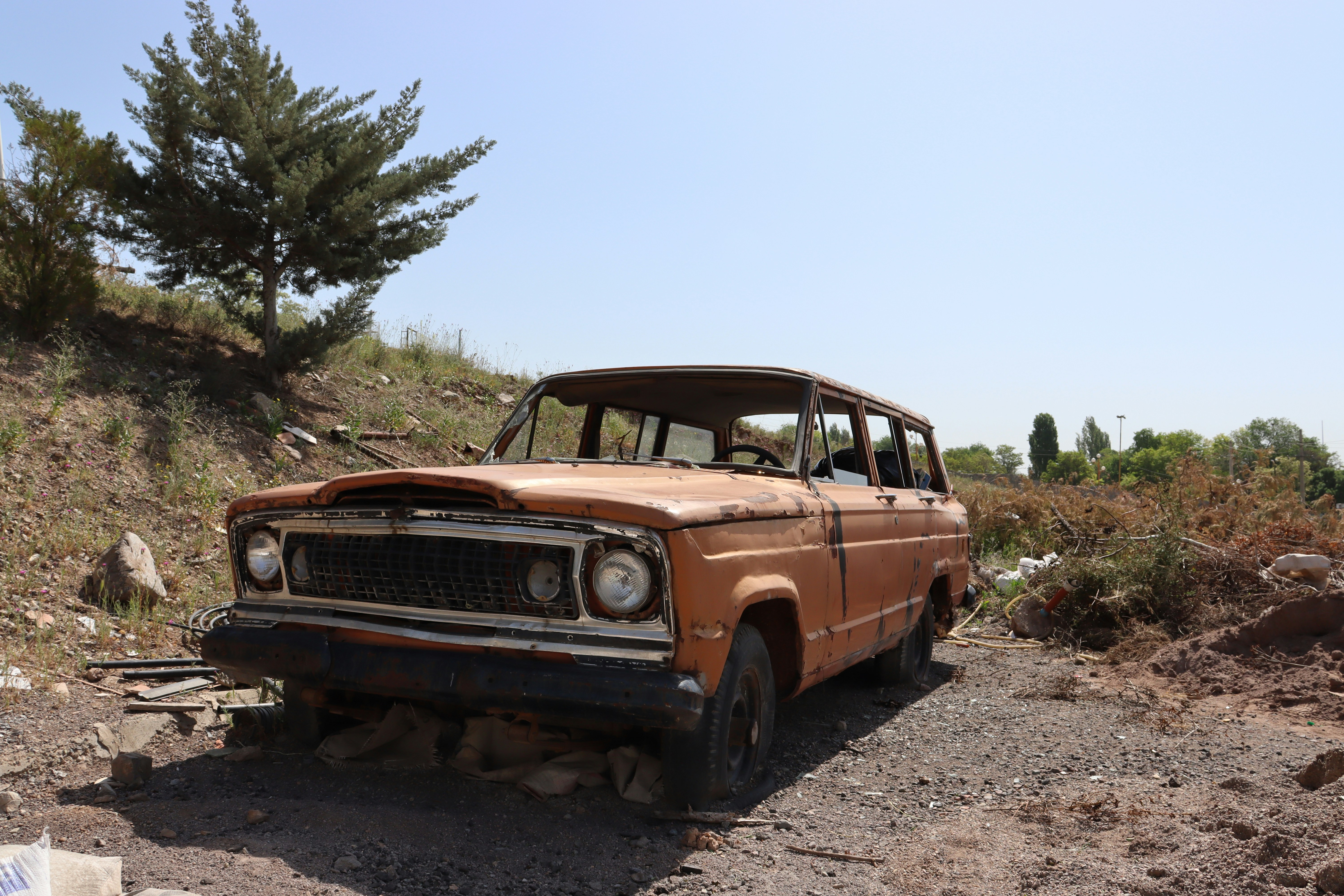 Rusting relic on a sunbaked slope