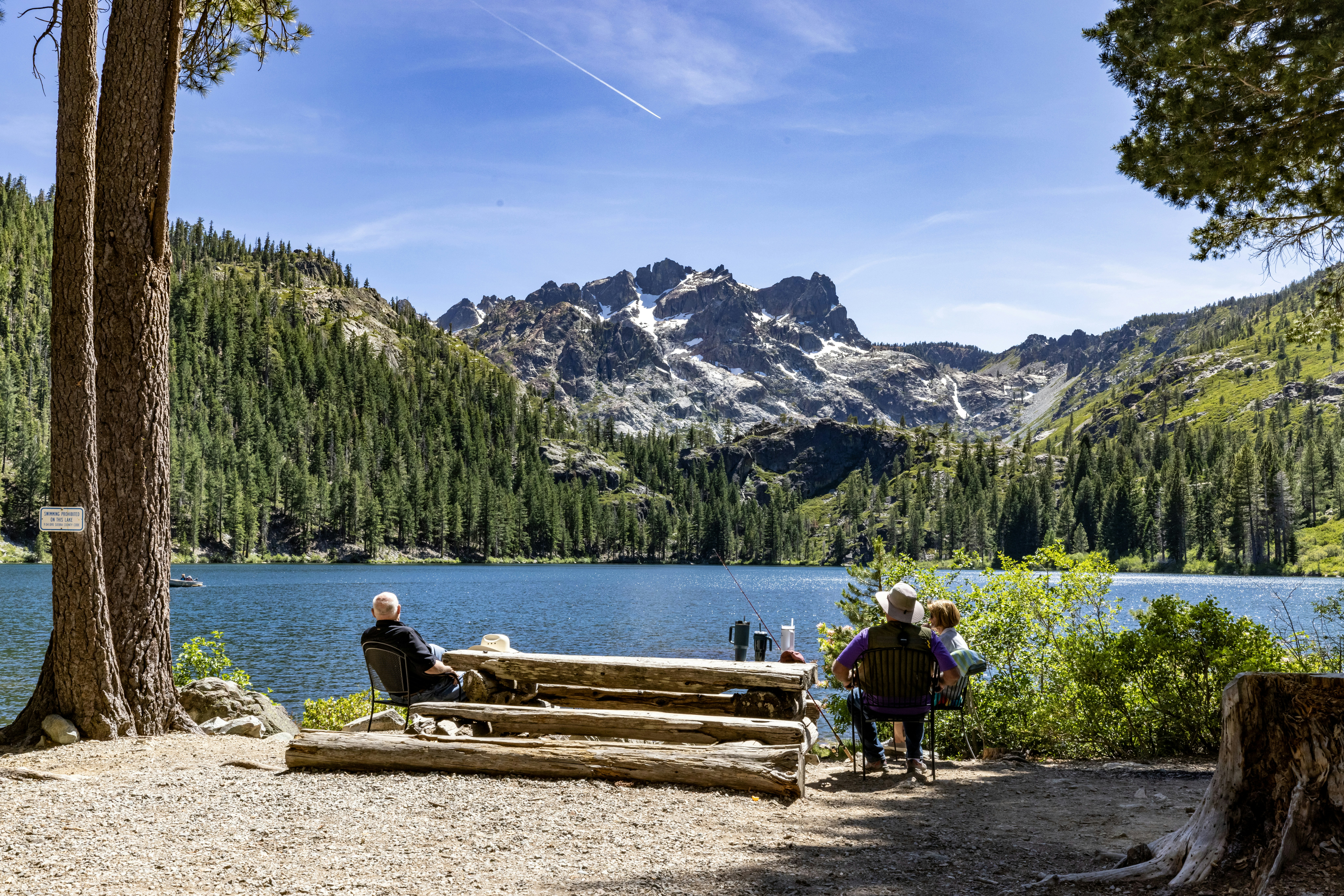 Revellers! | People enjoy a peaceful day at a scenic lake.
