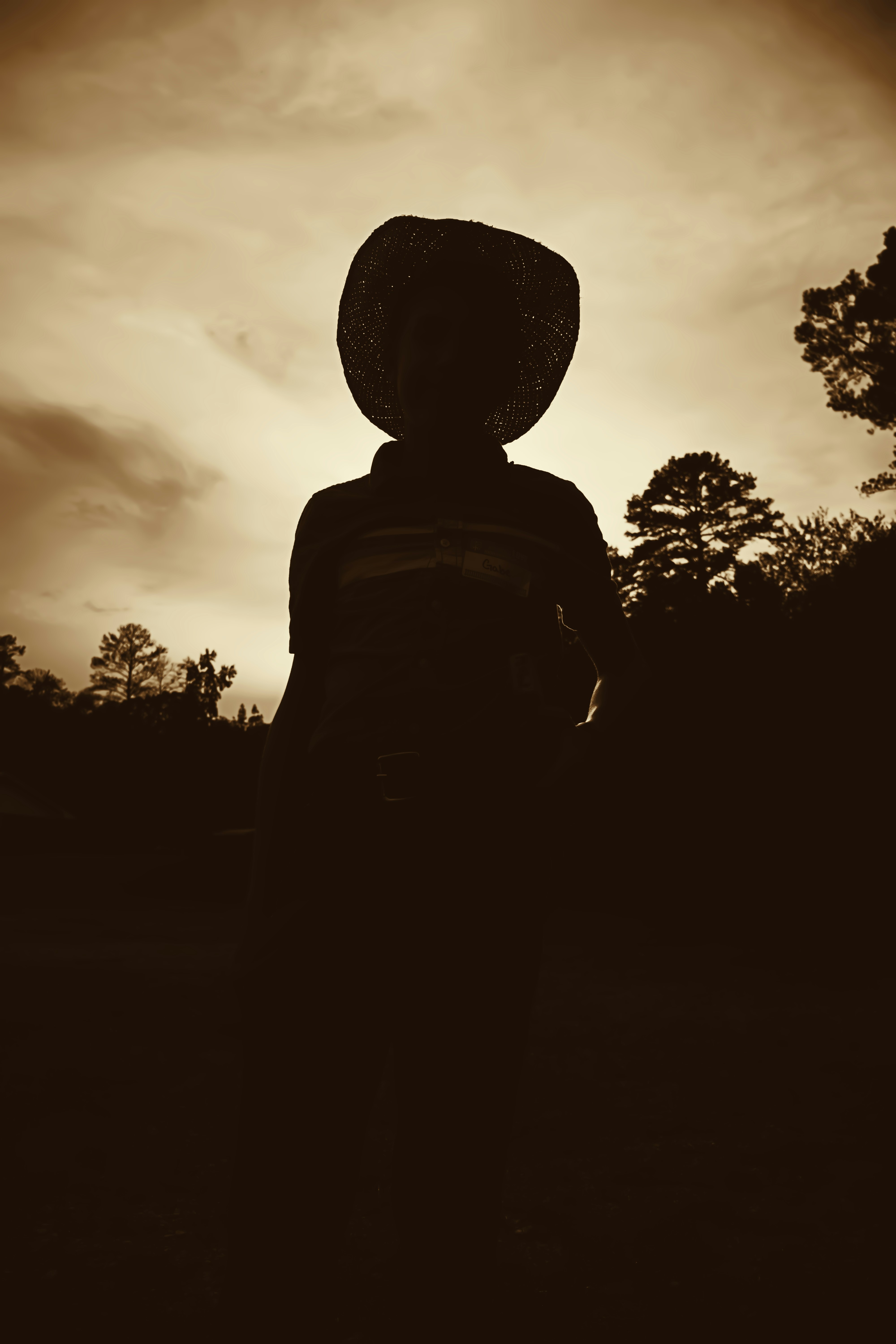 A person silhouetted by the setting sun.