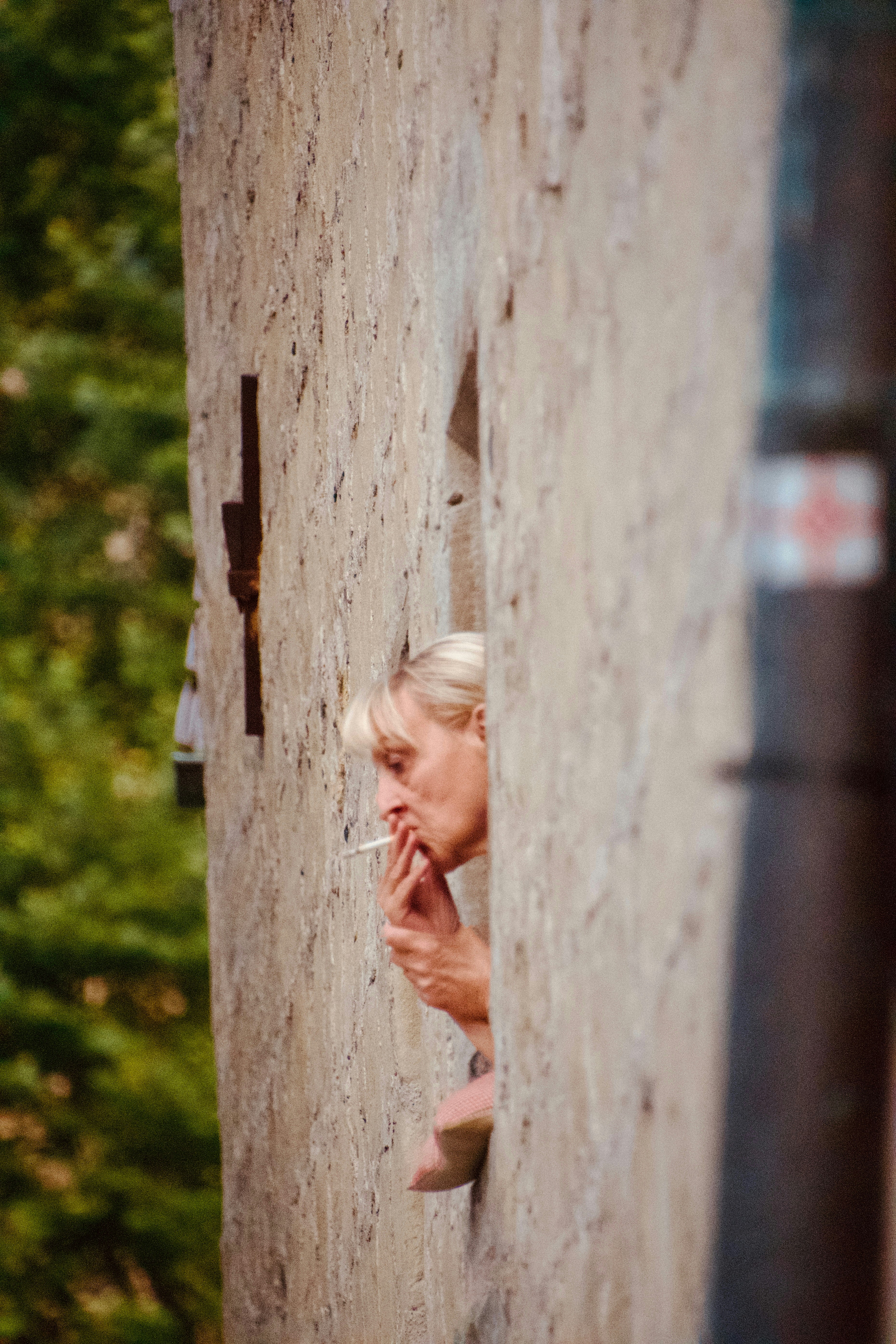 Cigarette Pause Between Stones: A Hidden Moment at the Wall