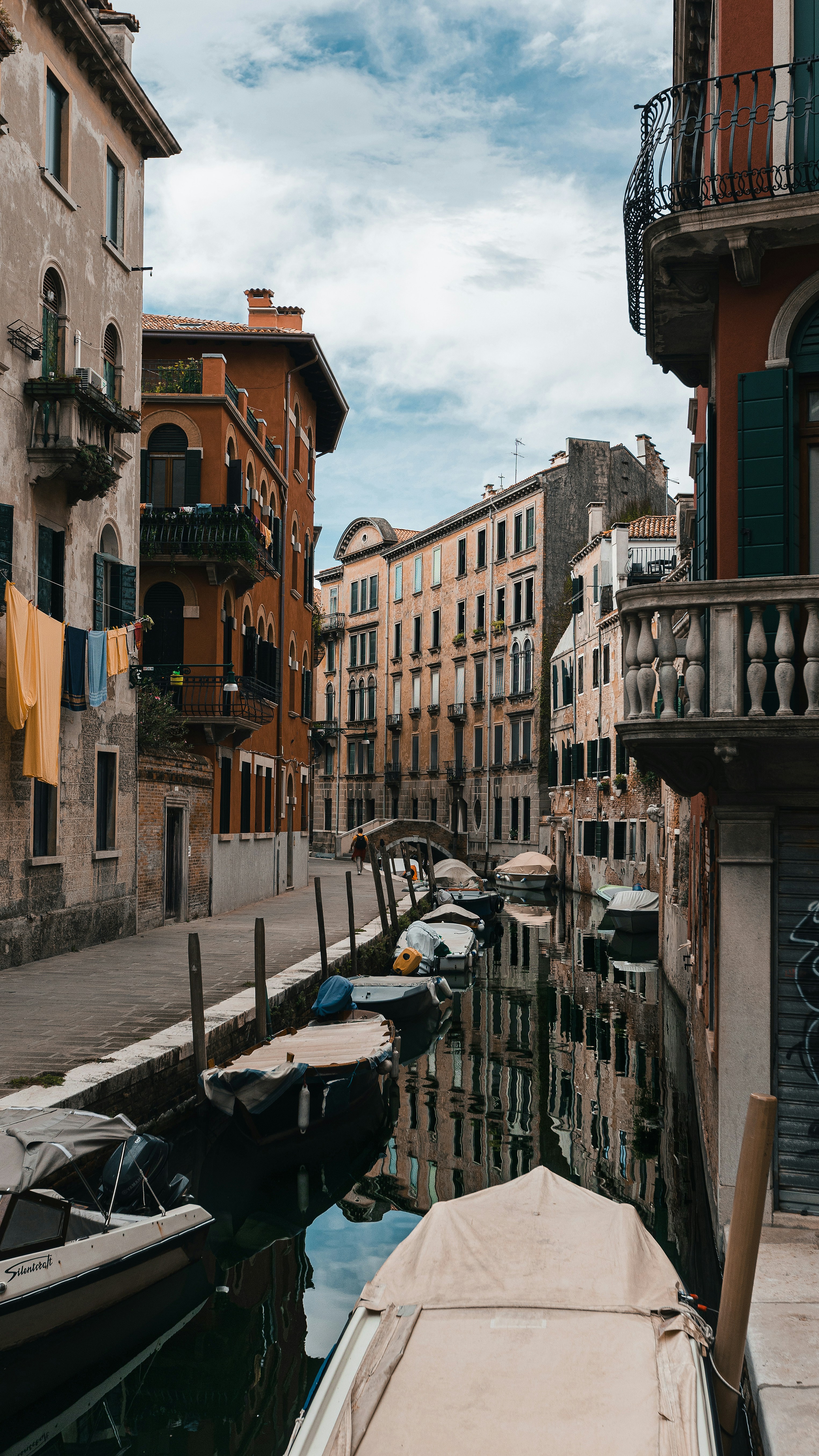 A canal in venice with buildings and boats.