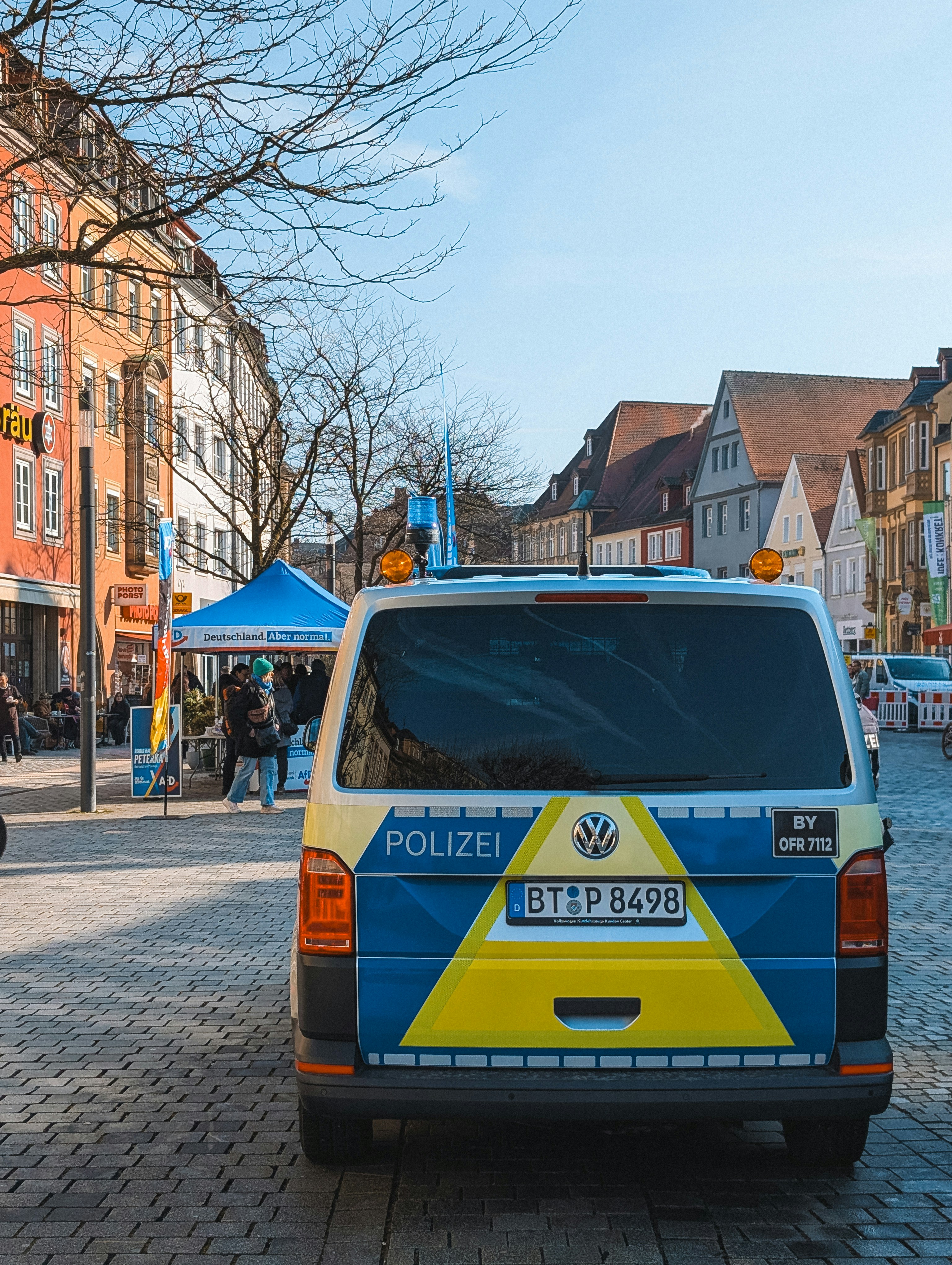 Police Van in Market Square | A german police van is parked on the street.