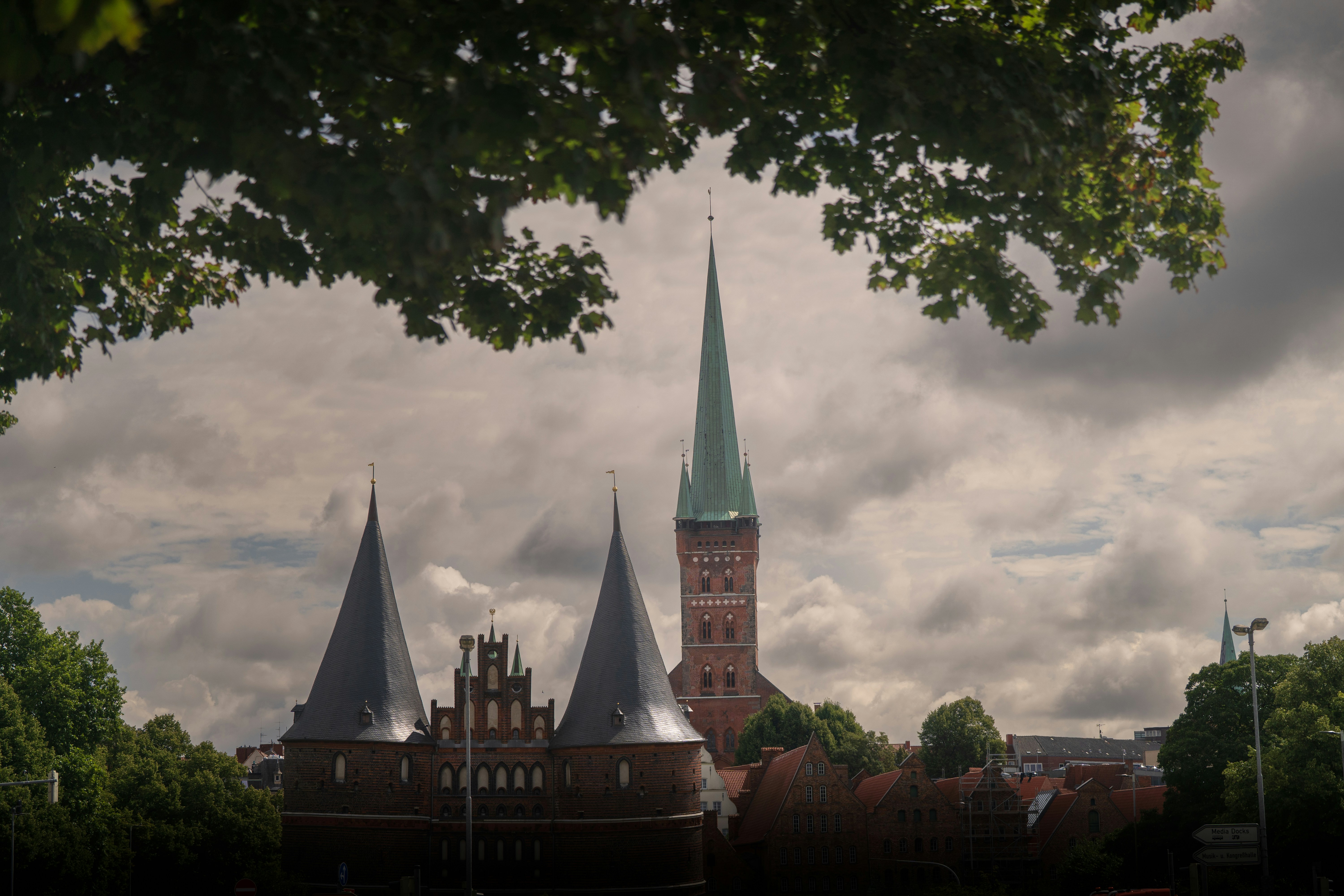 A historic building is seen in the distance.