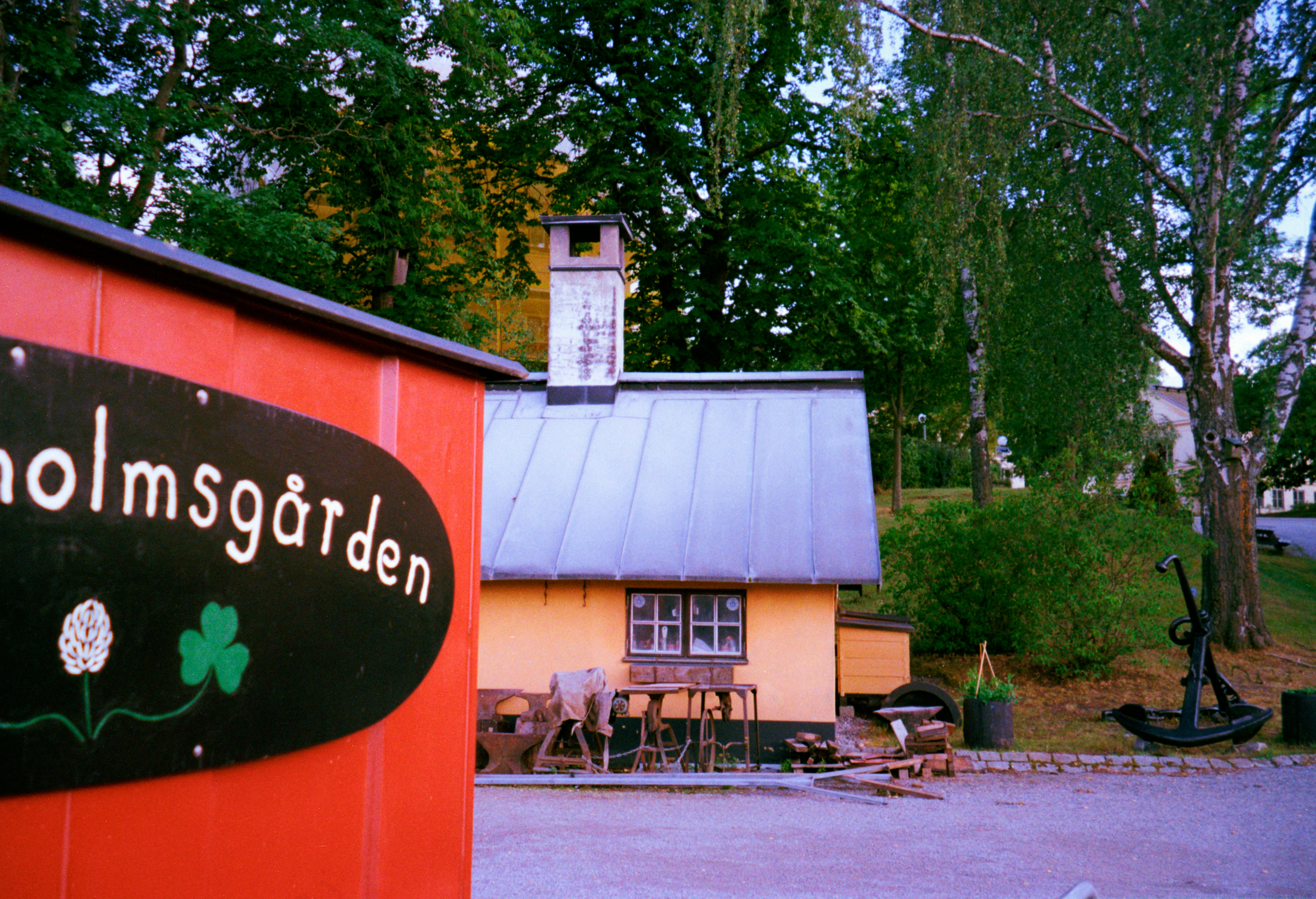 A small building with a sign in front. photo – Free Sweden Image on ...