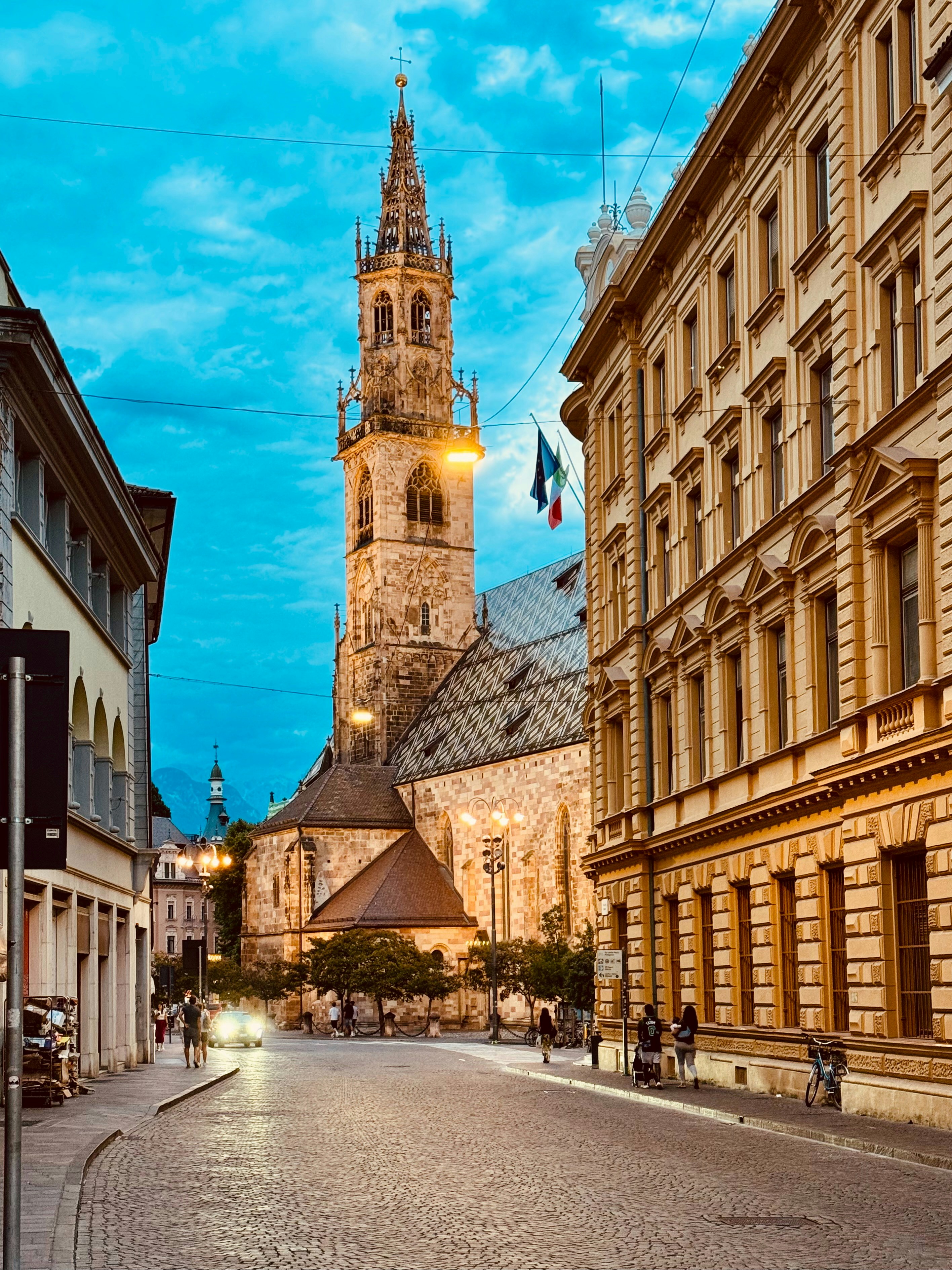 Bozen, Italy | A beautiful street in front of a tower.