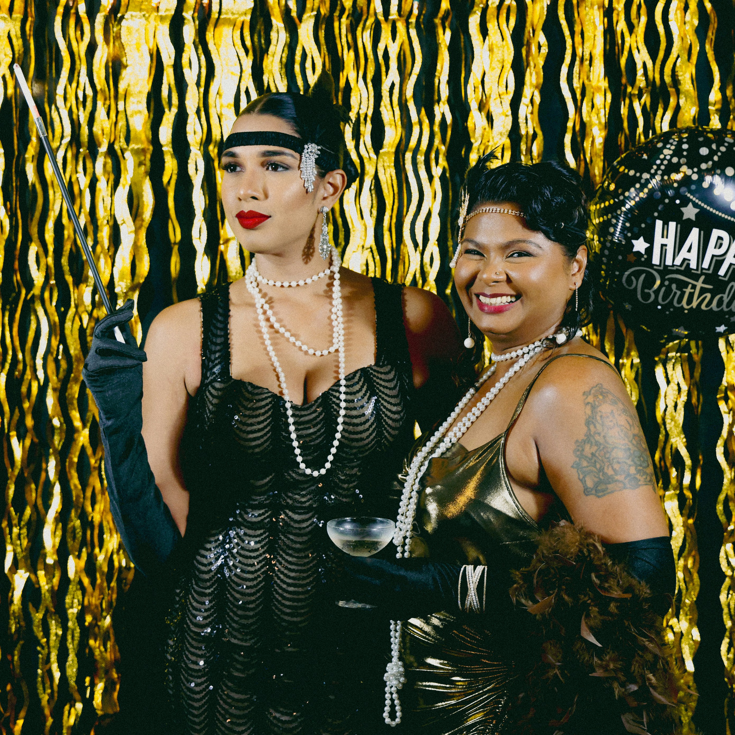 Great Gatsby themed party | Two women dress up for a roaring twenties party.
