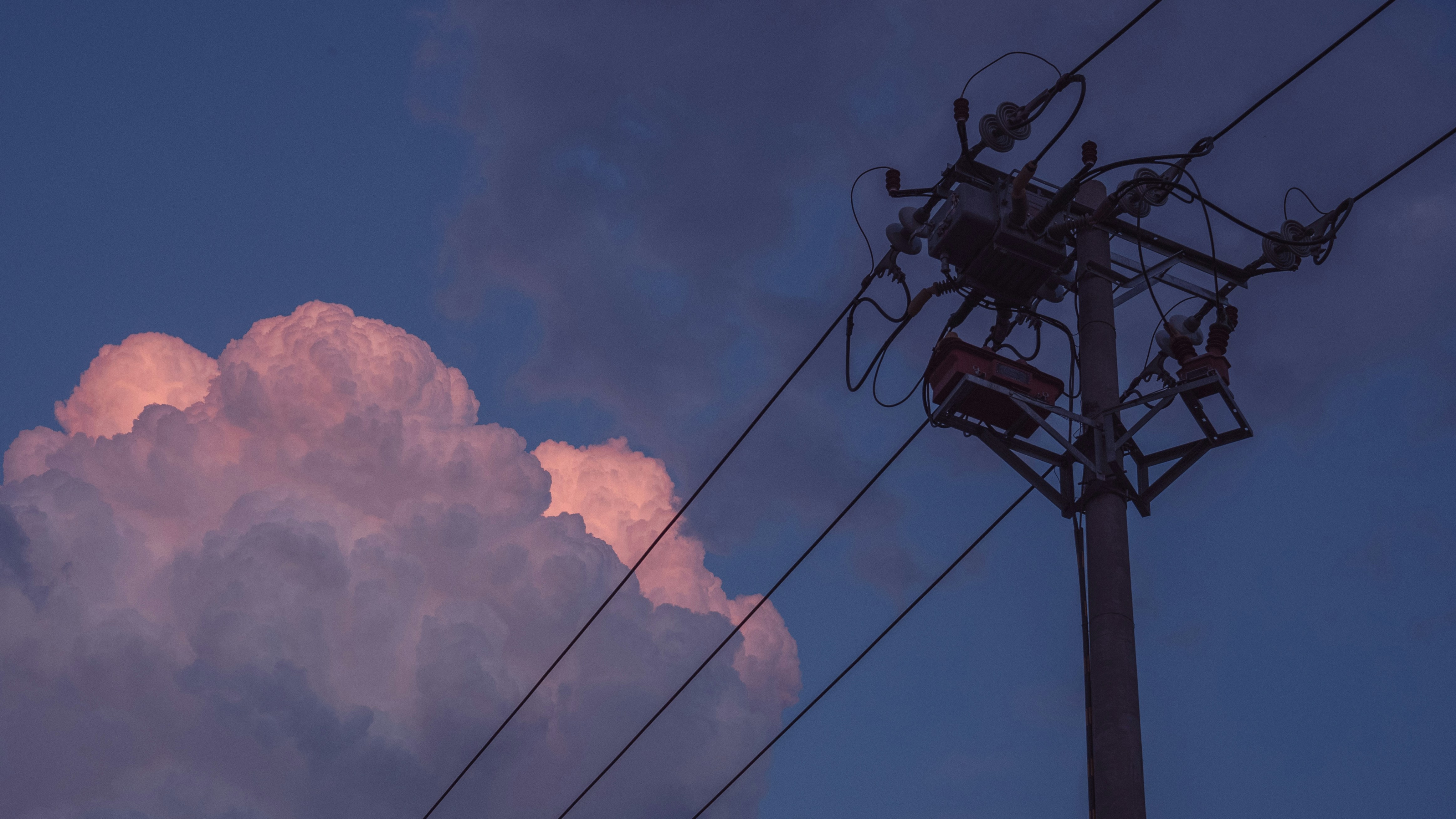 cumulonimbus | Power lines and pink clouds at dusk.