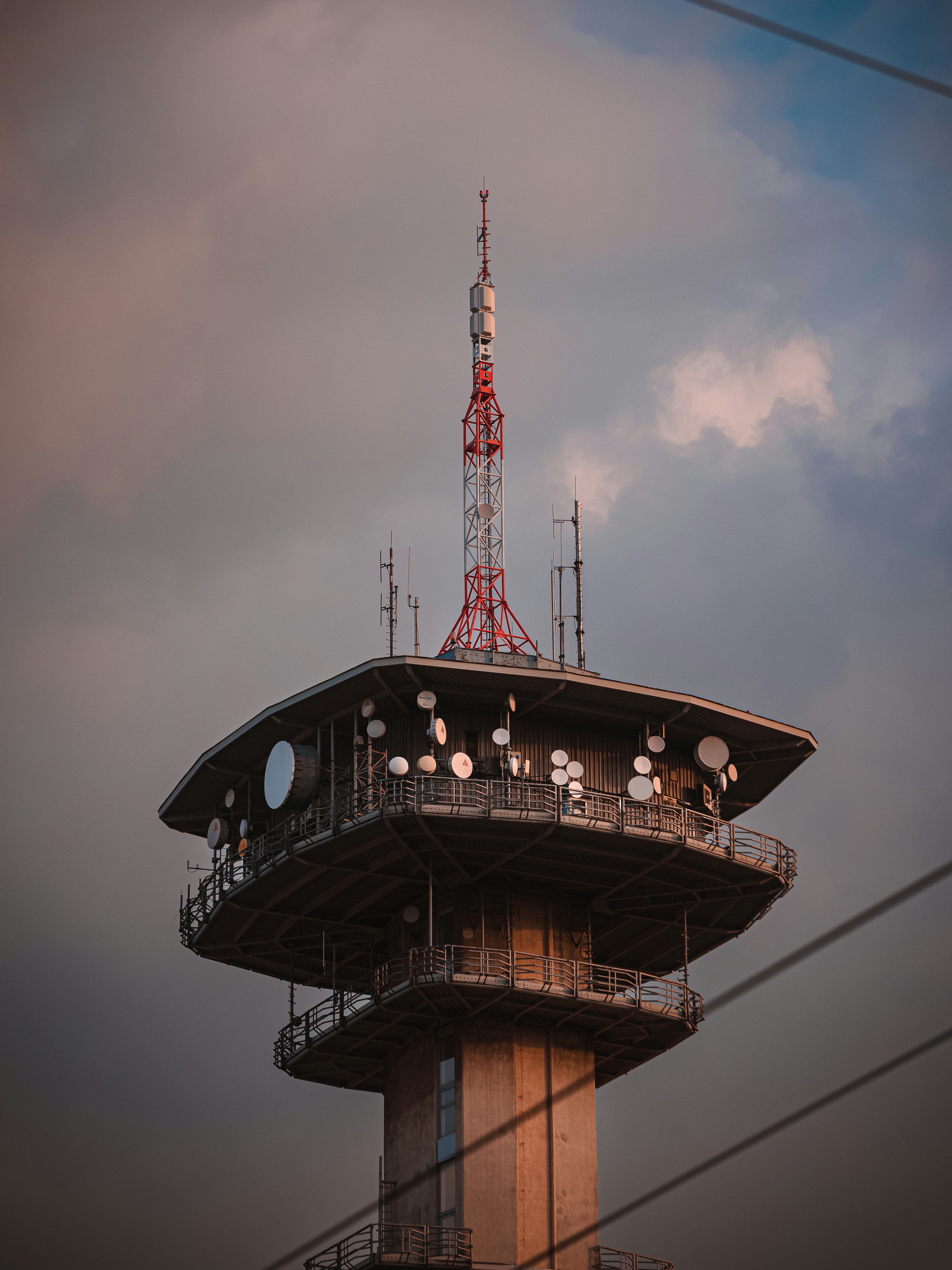 Concrete. Steel. Signal. No romance. | A communication tower reaches towards the sky.