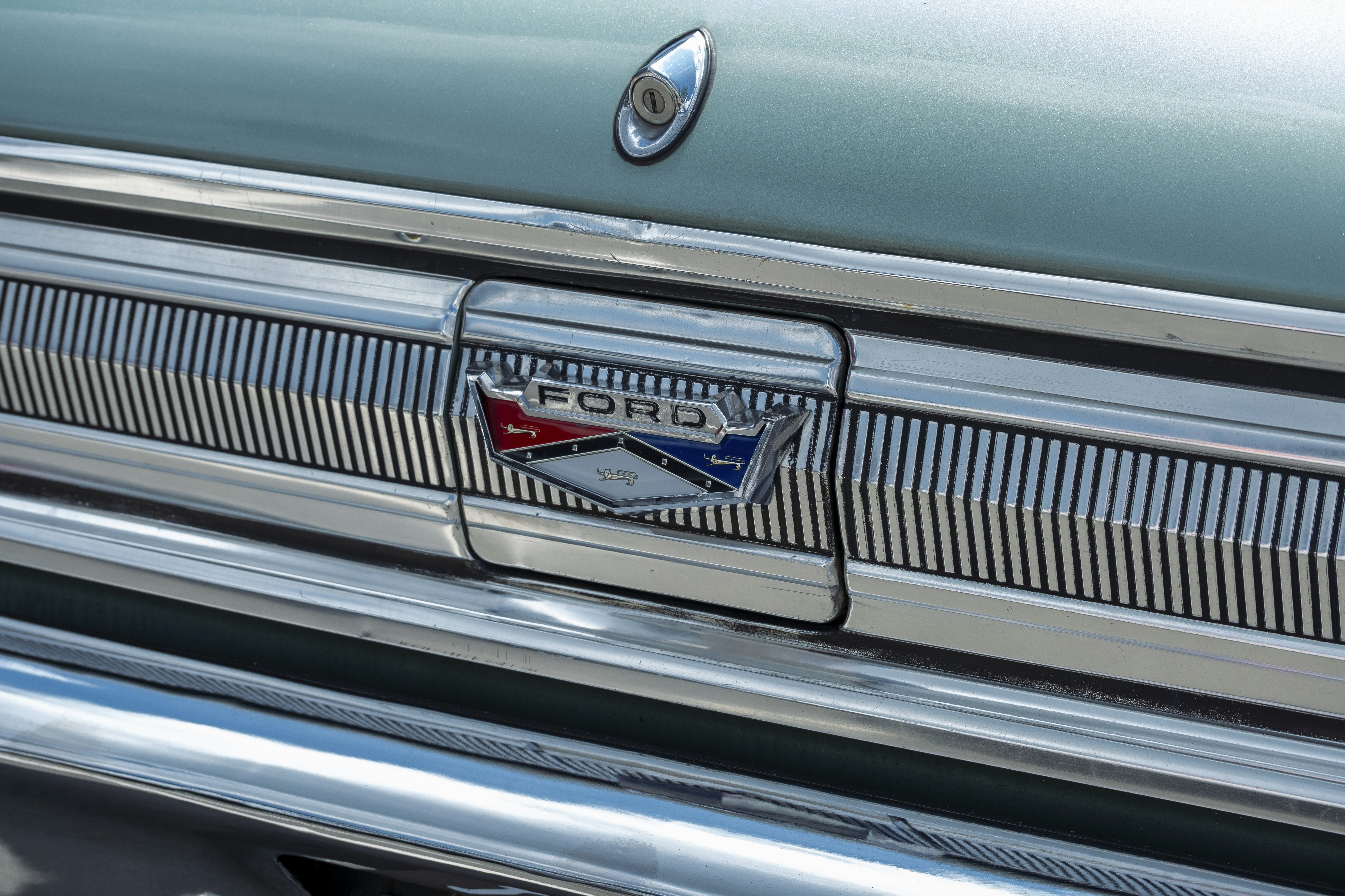 A close-up shows a classic ford emblem. photo – Free Logo Image on Unsplash
