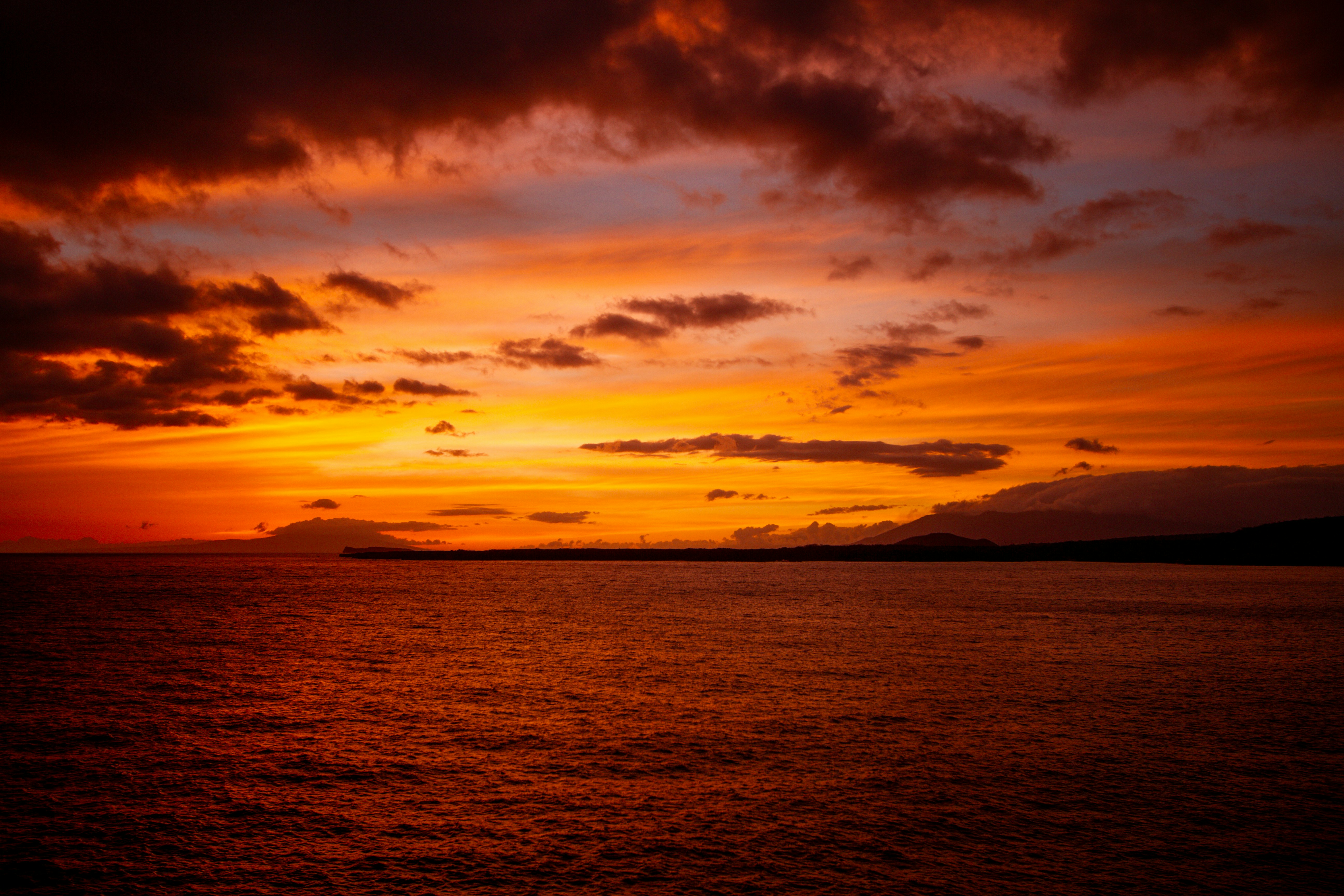 Sunset Shades of Orange | Fiery sunset over the calm ocean.