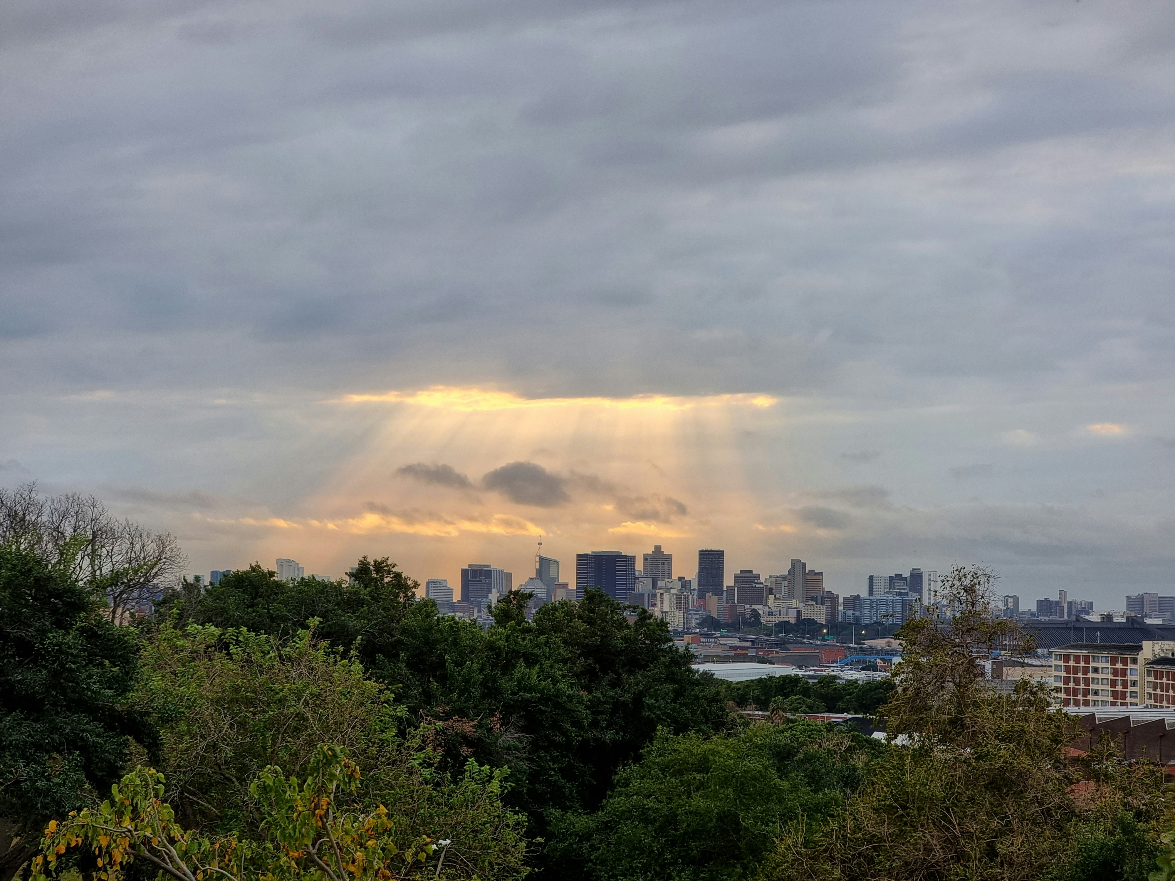The windows of heaven open up over the city of Durban | Sunlight streams down upon the city skyline.