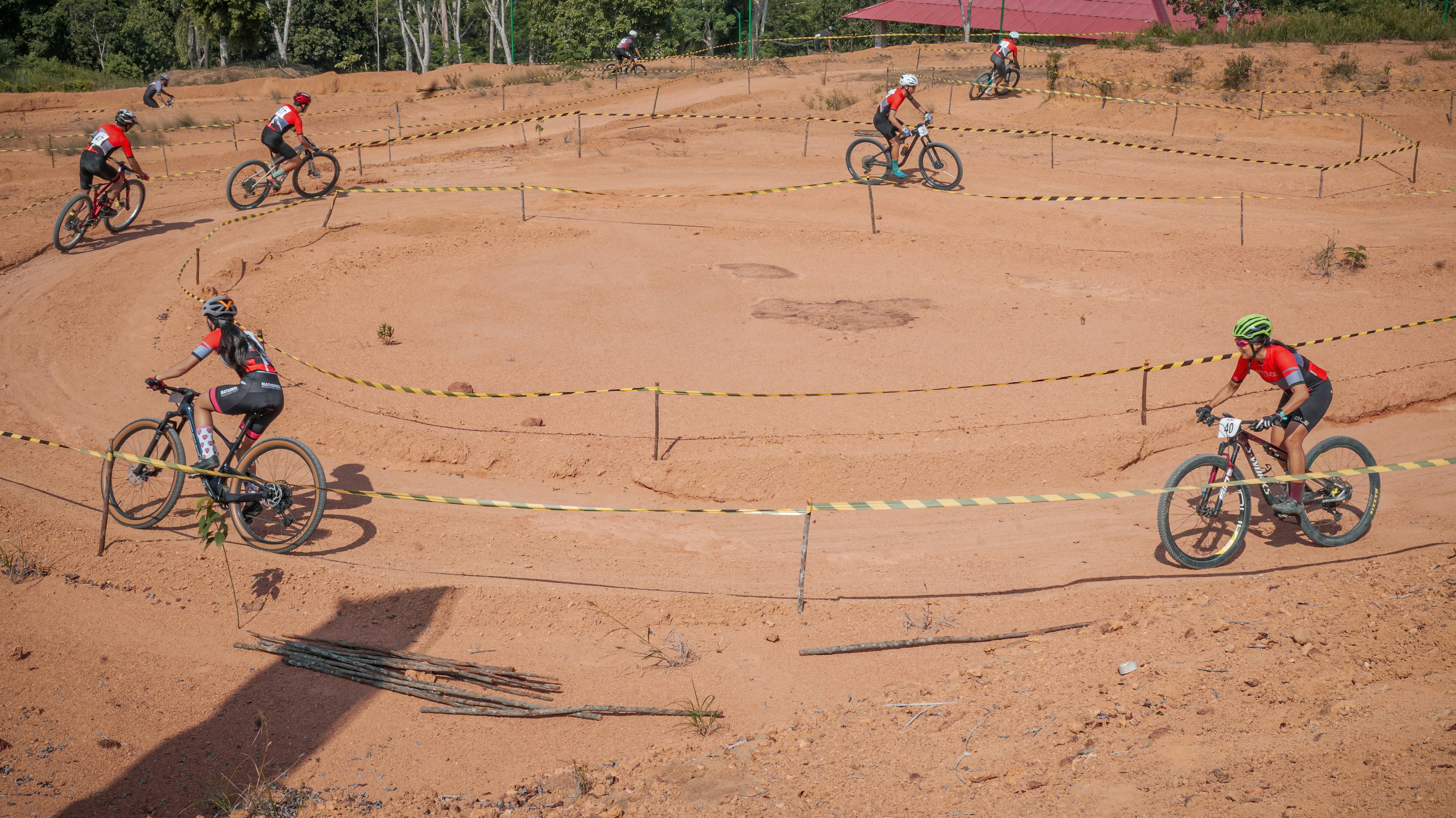 Dust Trails and Red Jerseys: Navigating a Tape-Lined Dirt BMX Course