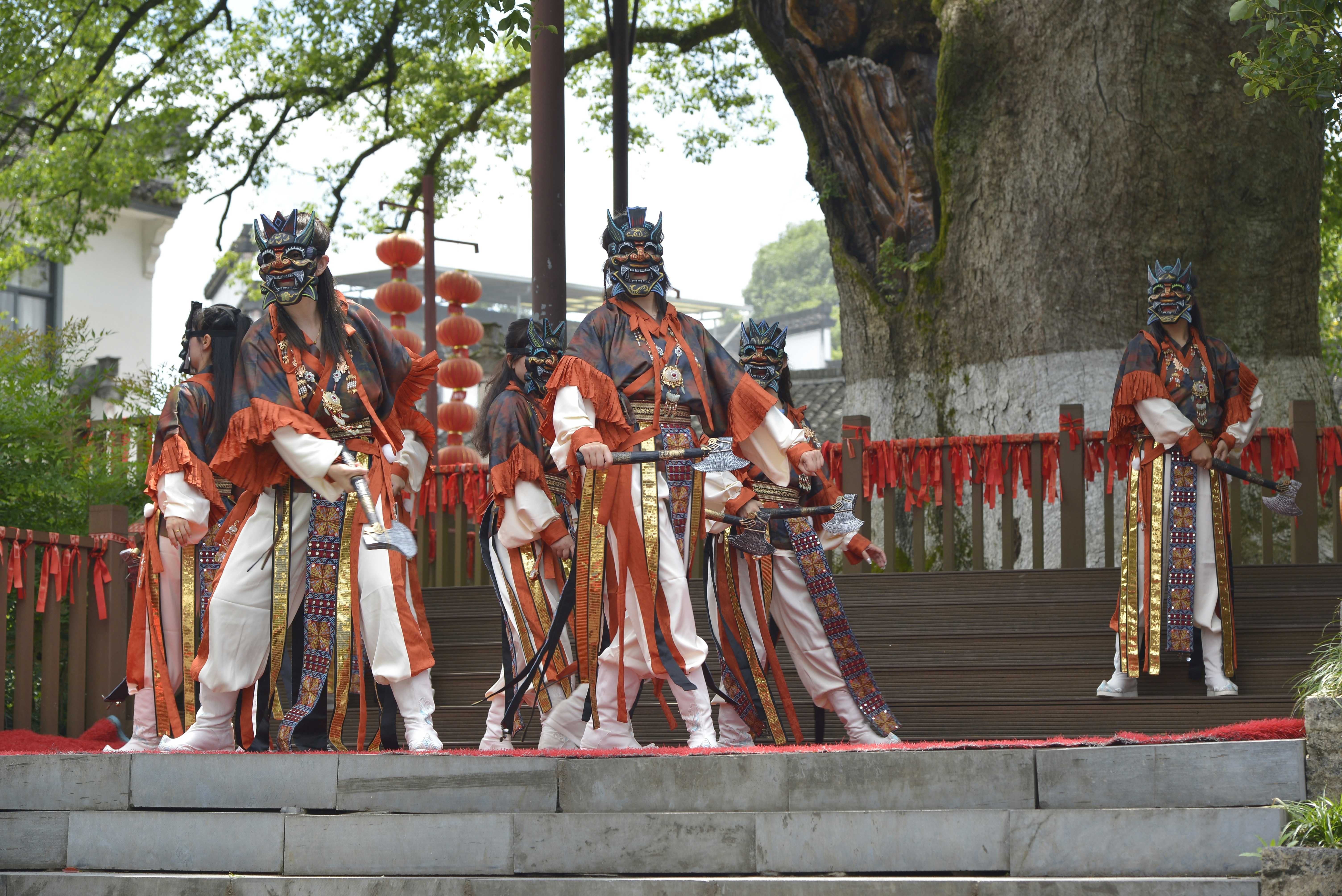 Crimson-clad Guardians on Temple Steps: A Ceremonial Procession