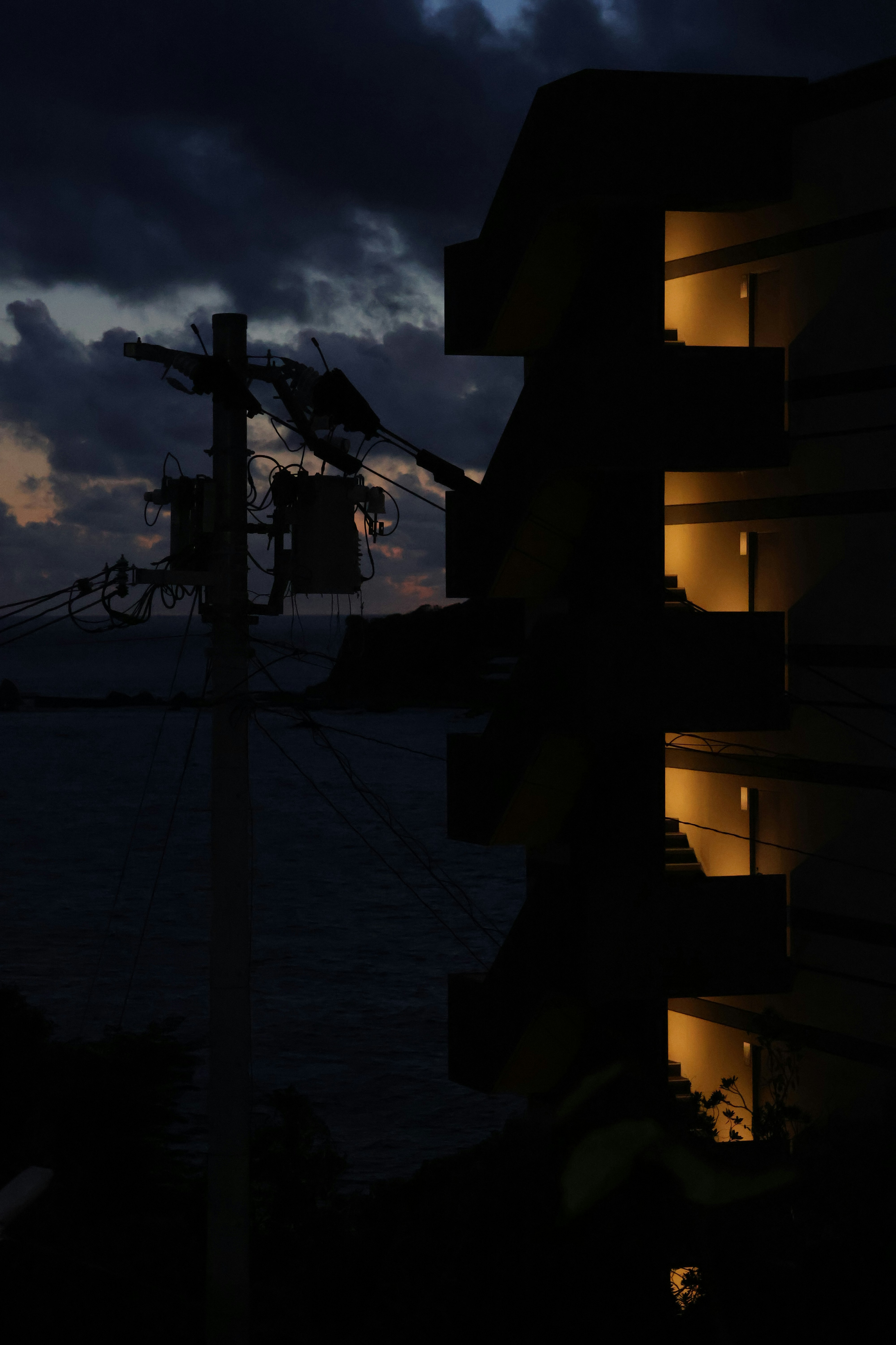 Whispers of Twilight: Urban Silhouettes by the Sea