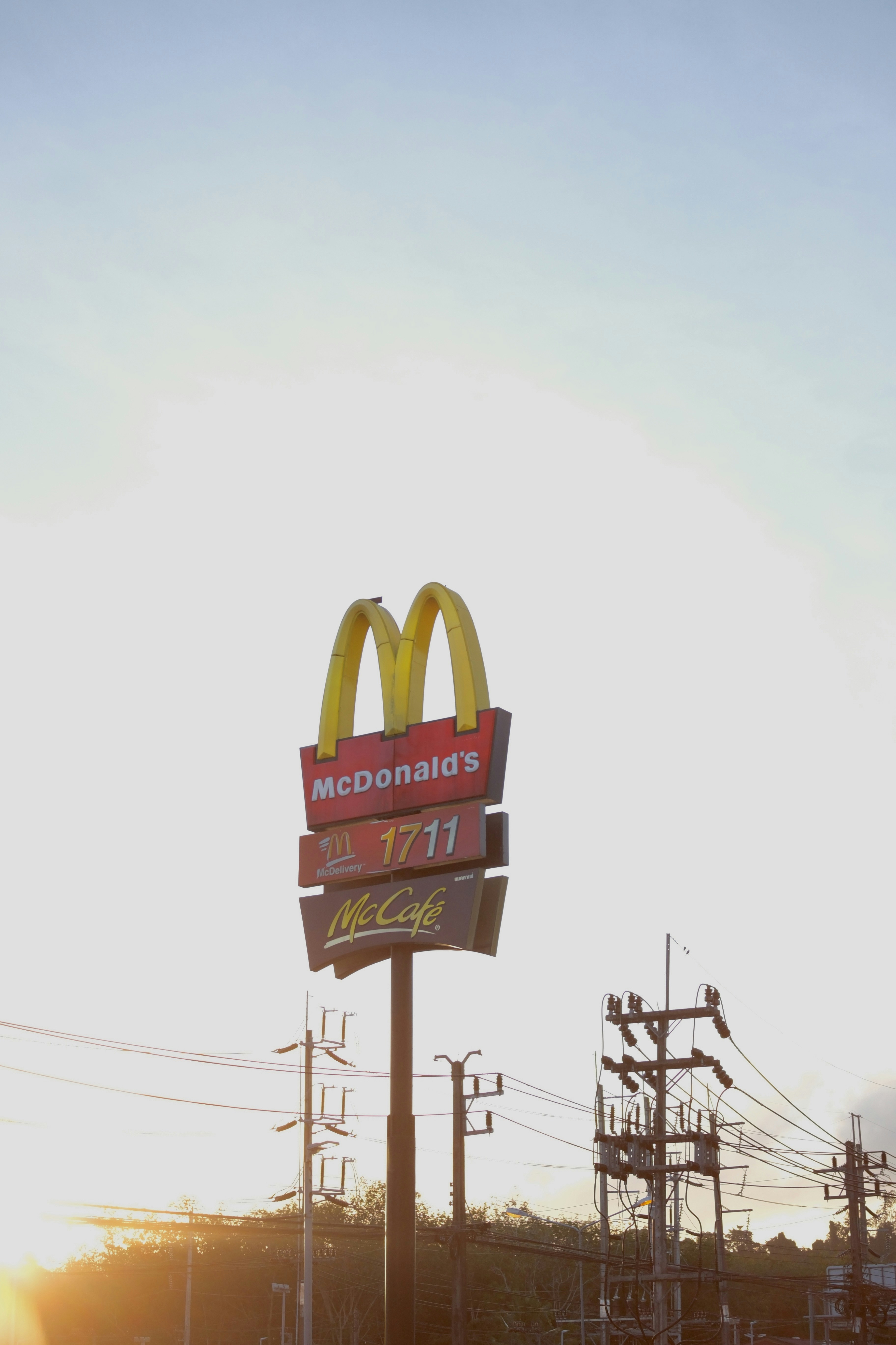 Mcdonald's sign against a bright sky