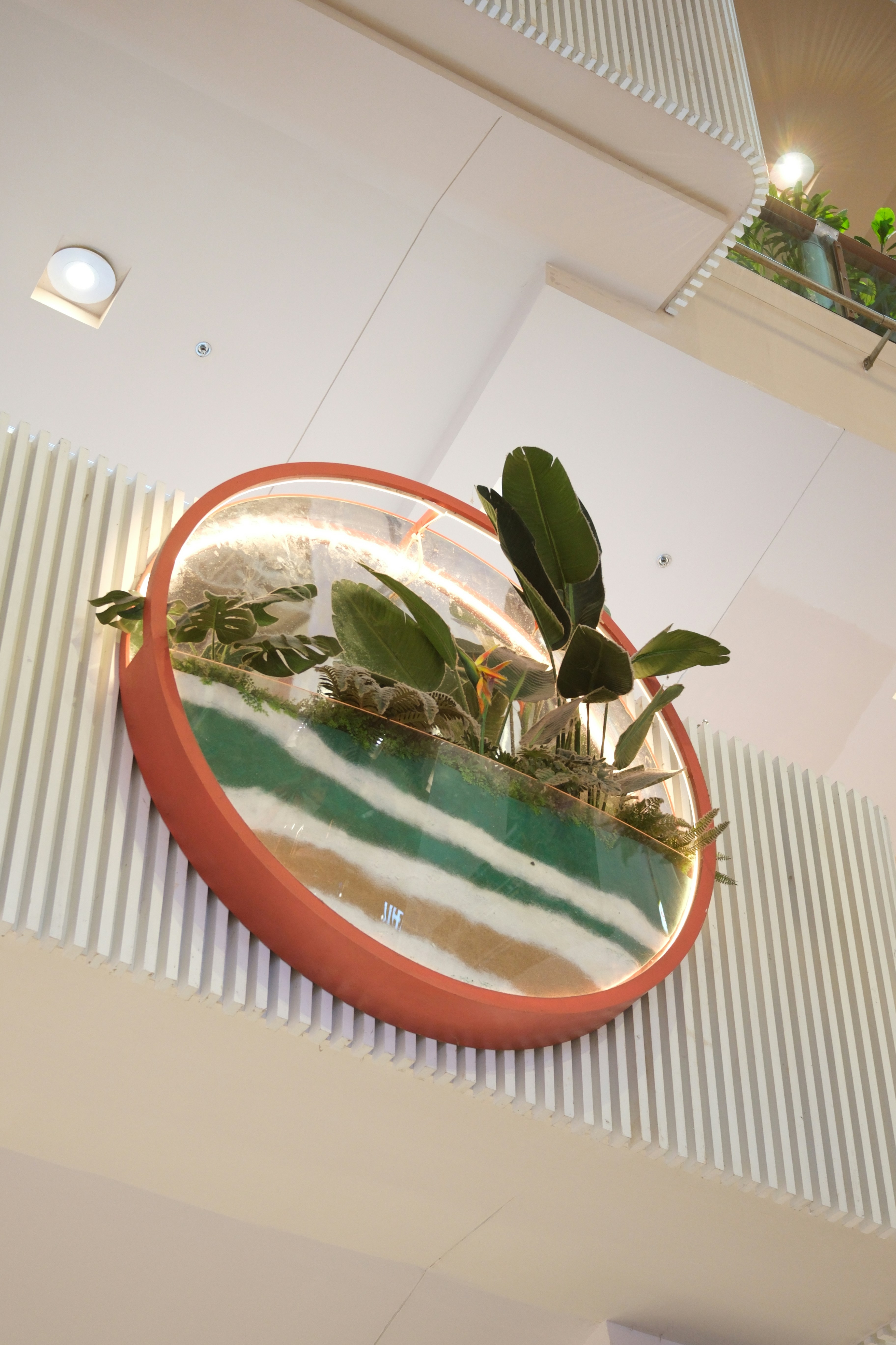 Upside-Down Terrace: A Circular Planter Halting a Balcony's Gaze