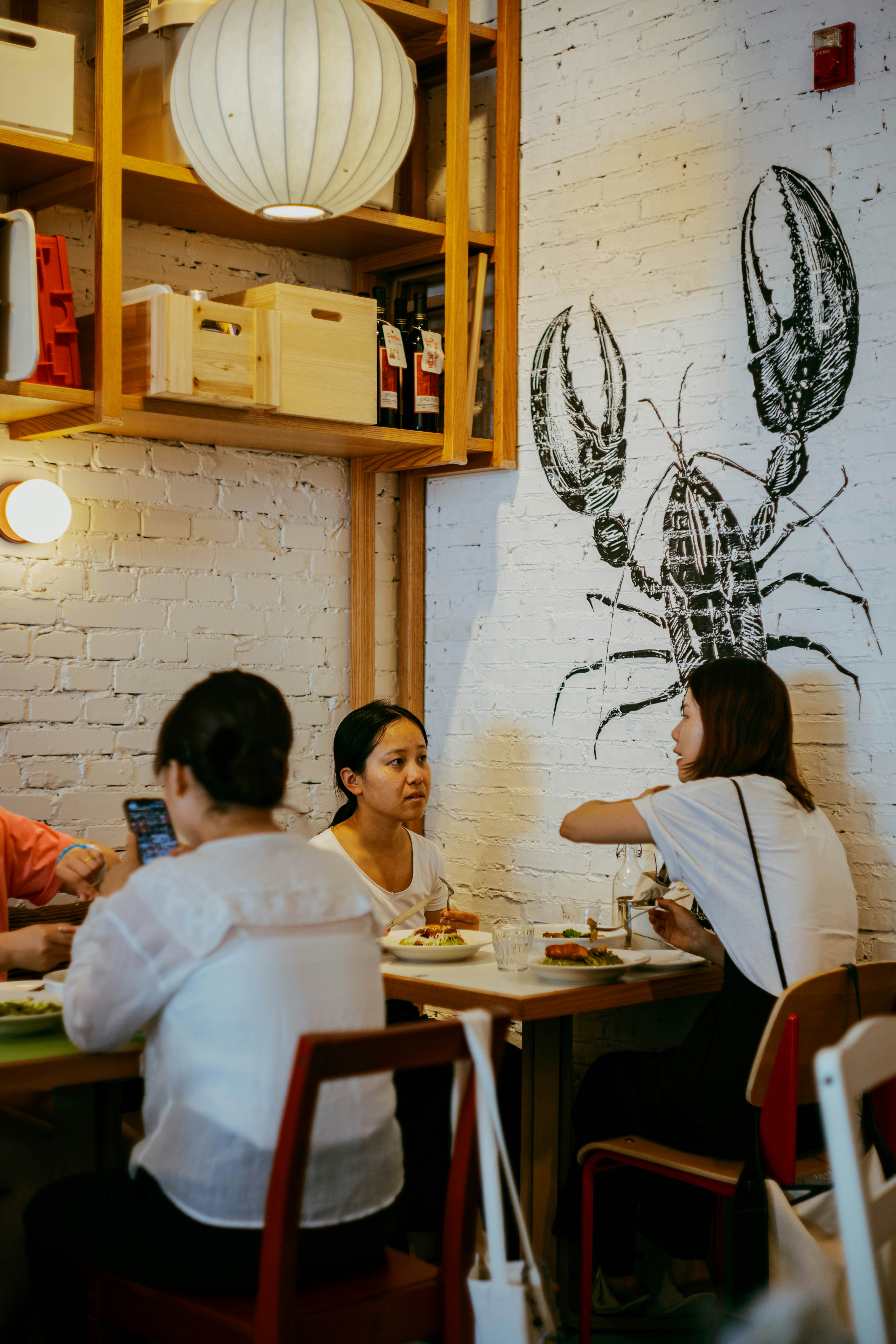 Culinary Conversations Under Lobster Art