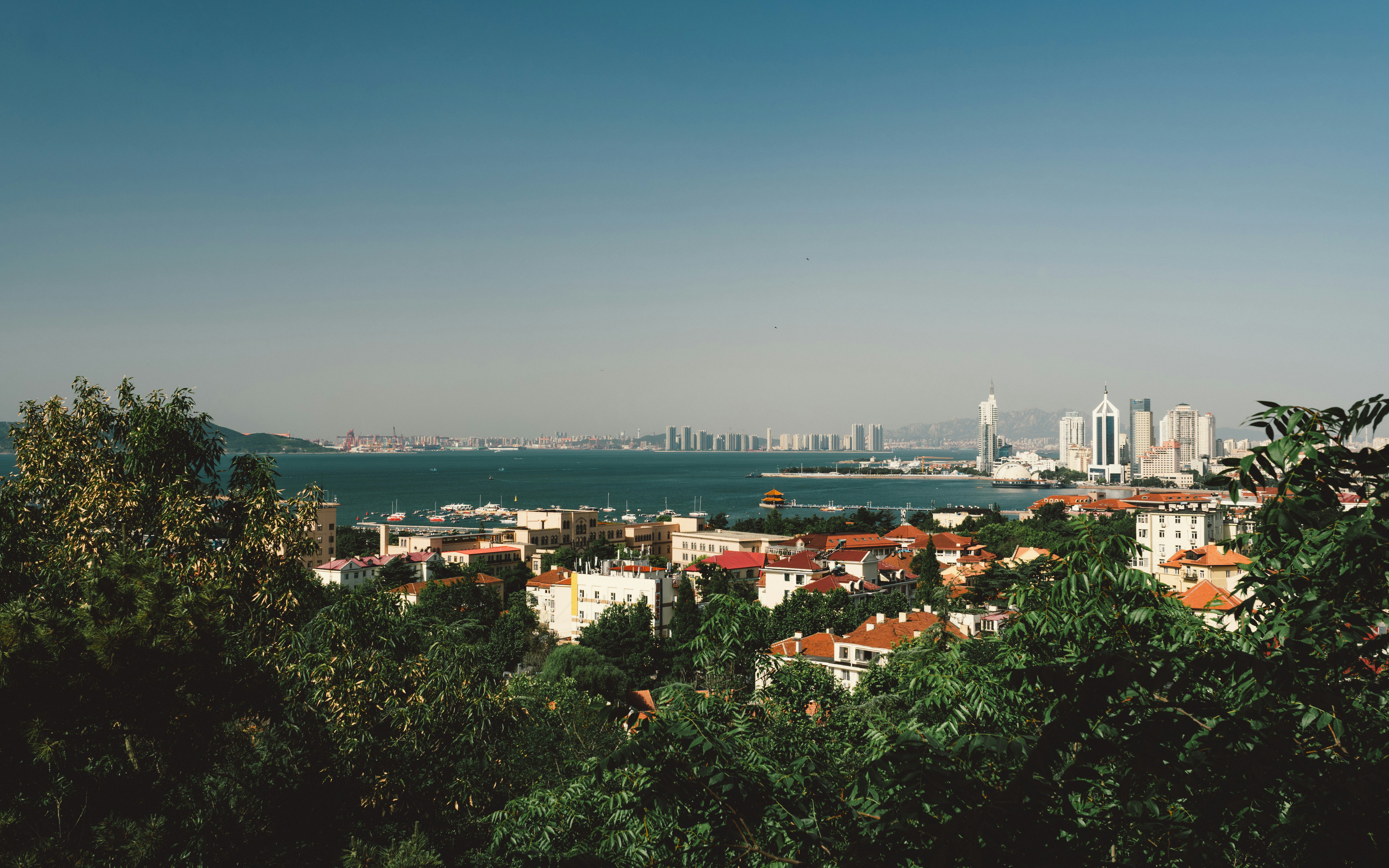 Cityscape view of buildings and water.