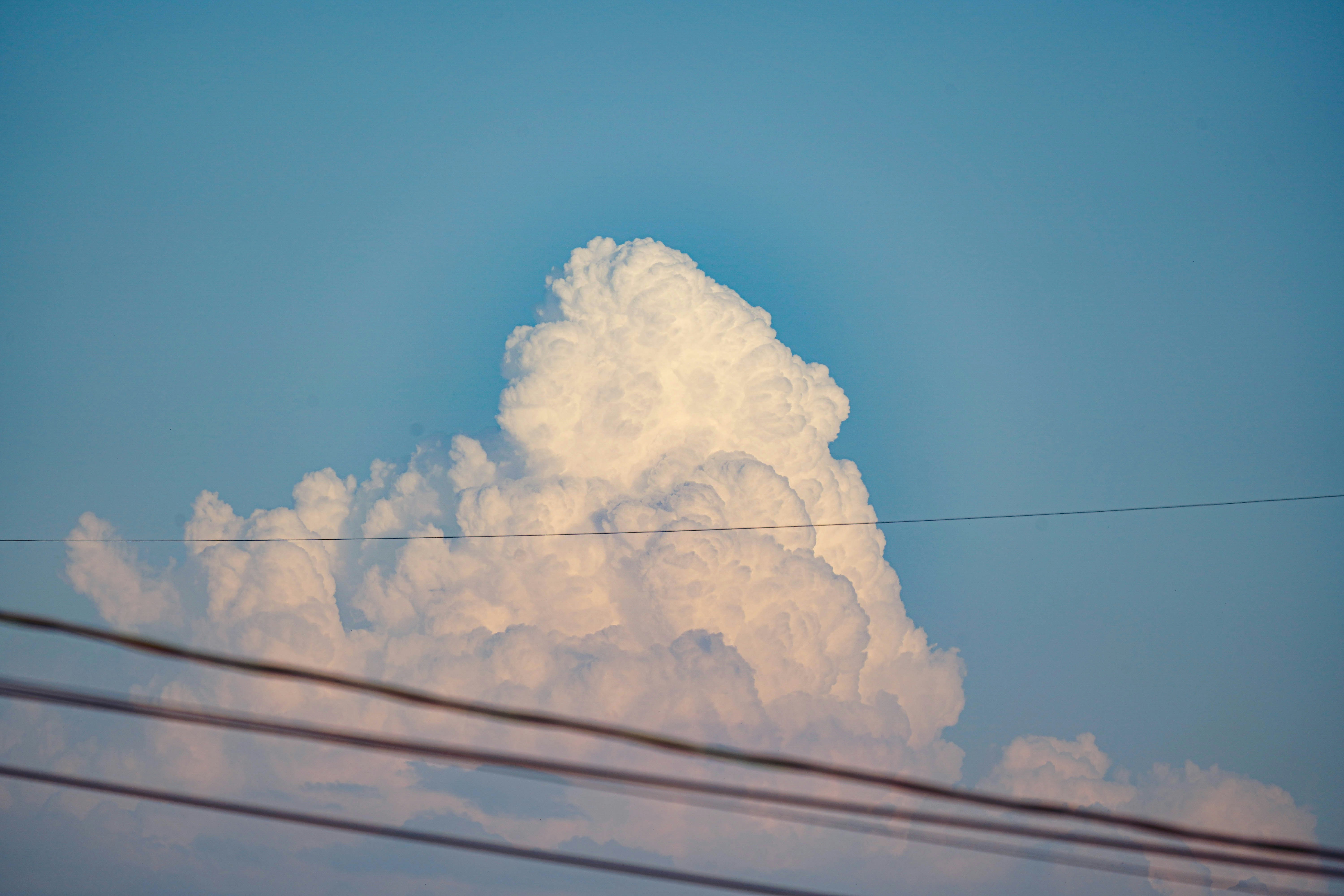 A big, fluffy cloud floats in the sky.