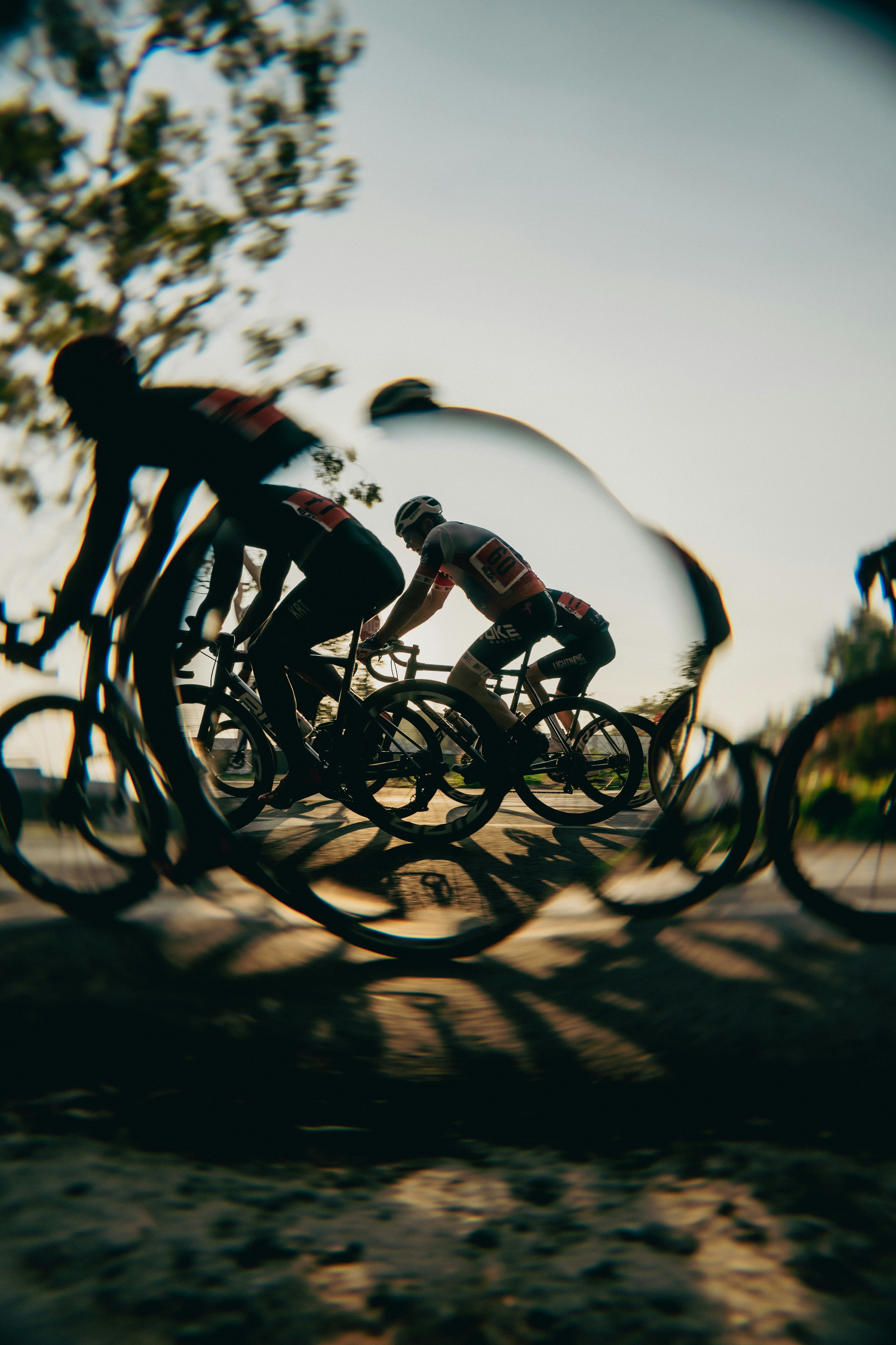 Cyclists race on a sunny day.