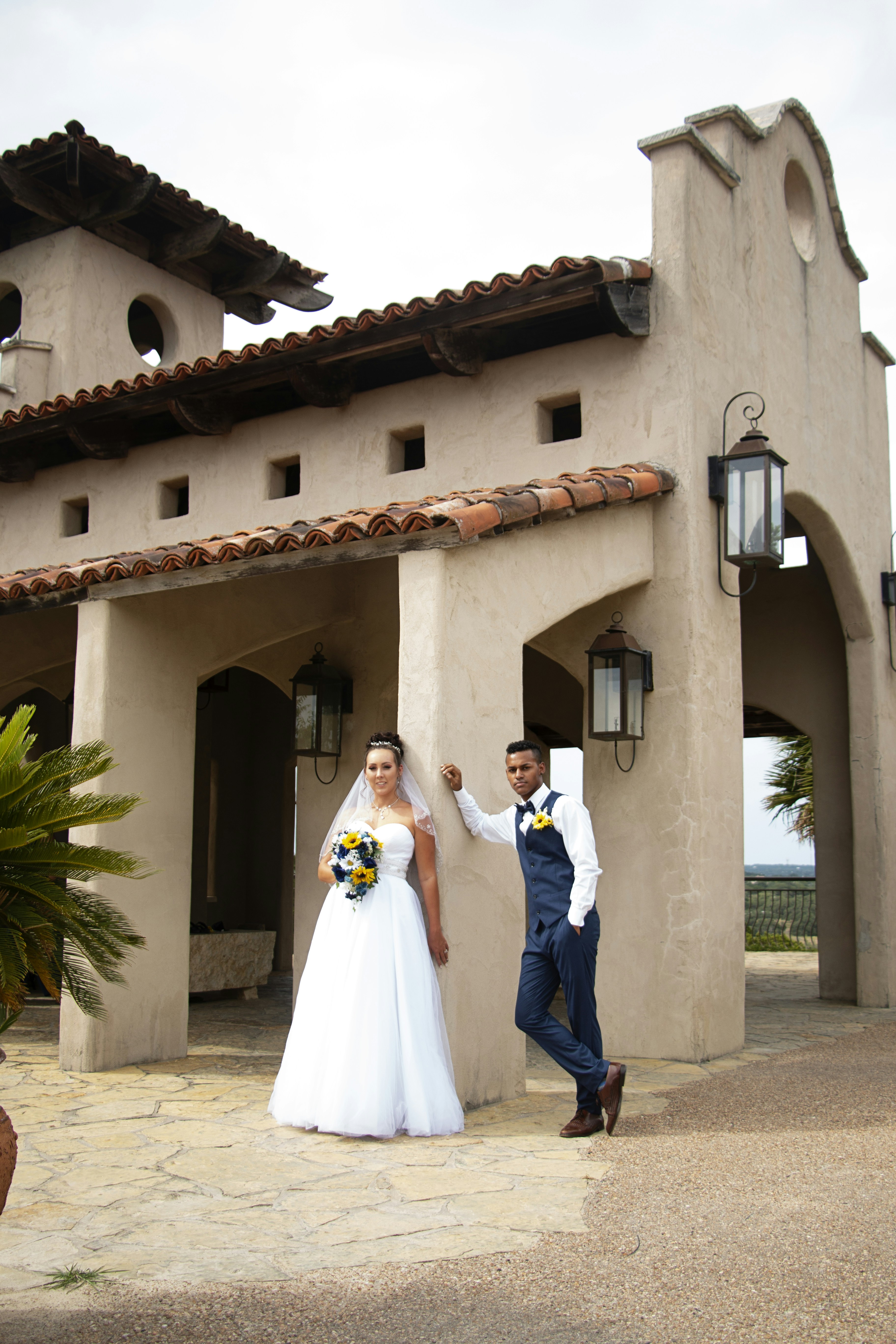 Courtyard Waltz Beneath Mediterranean Arches: A Wedding Moment