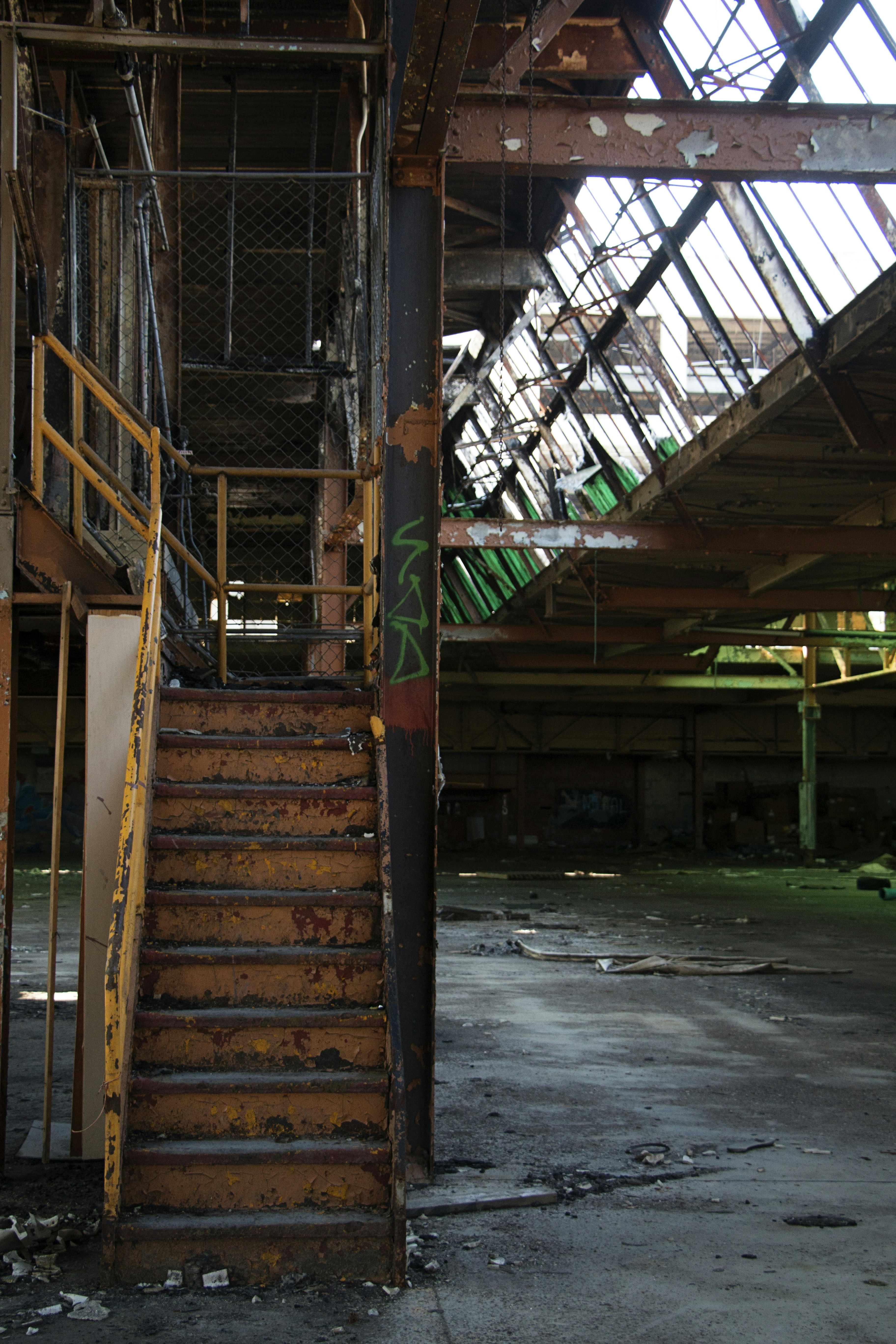 industrial, stairs, metal, metal stairs, factory, old factory, abandoned, steel | Rusting stairs inside an abandoned industrial building.