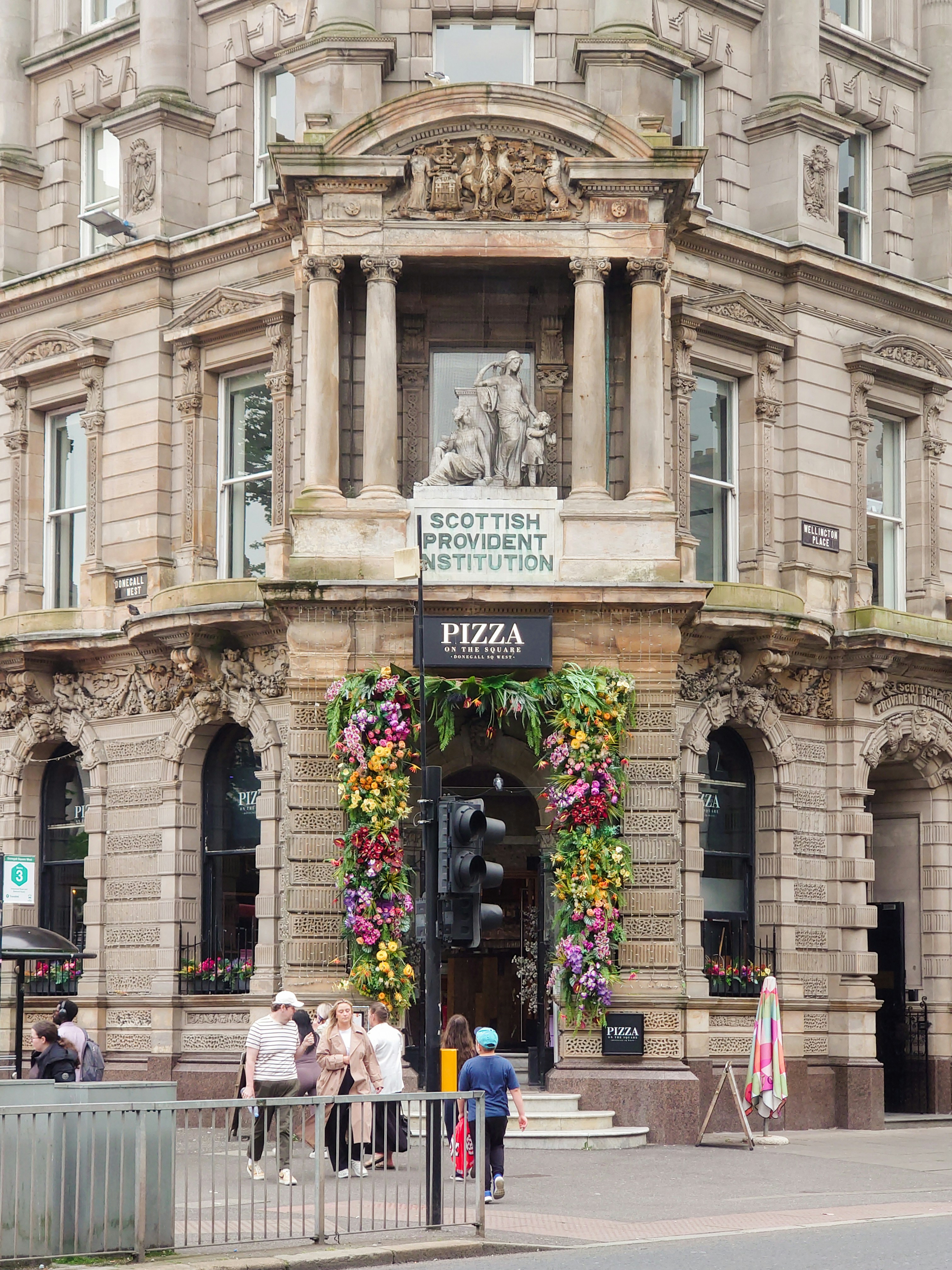 A pizza restaurant resides in a historic building.