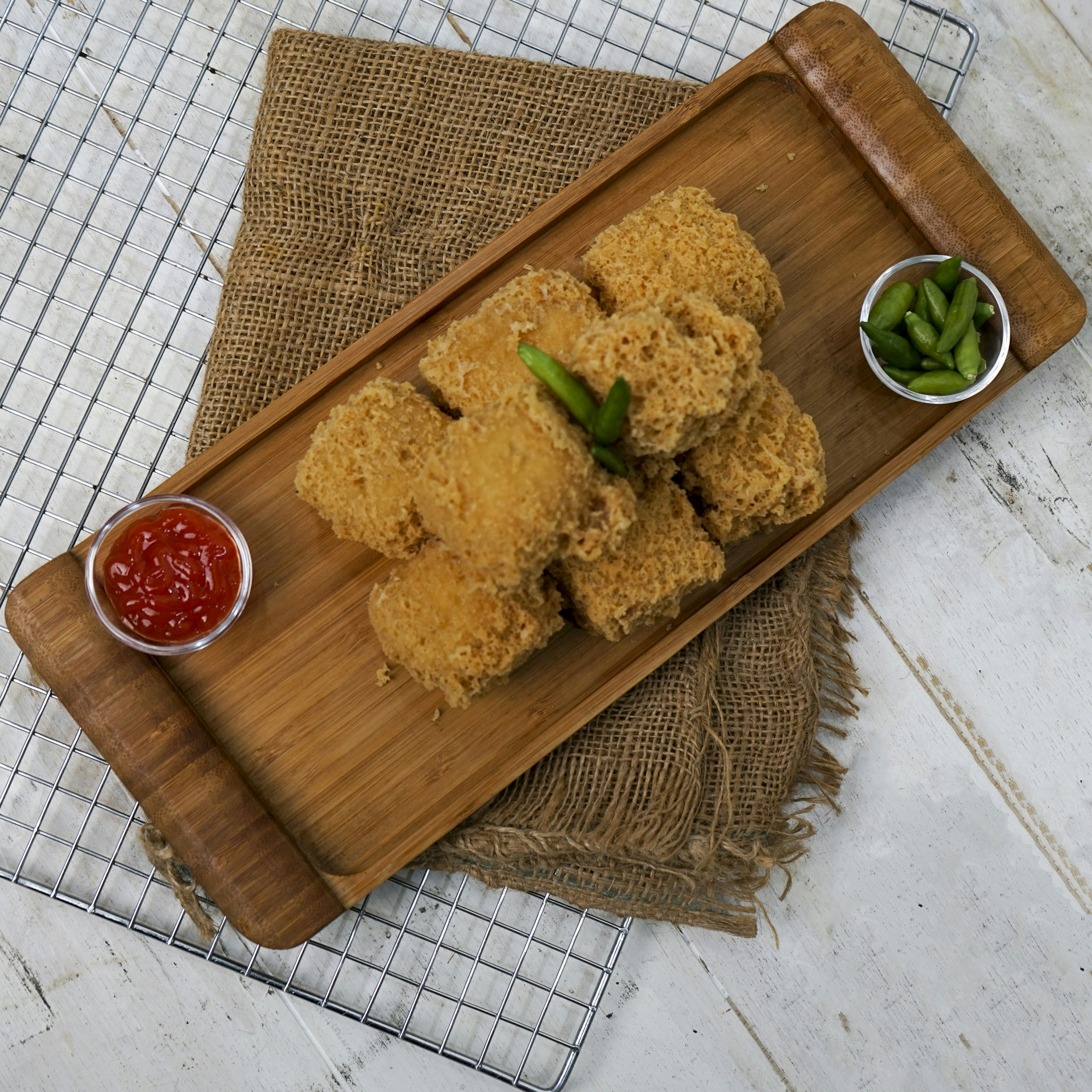 Fried food served with condiments and chilies.