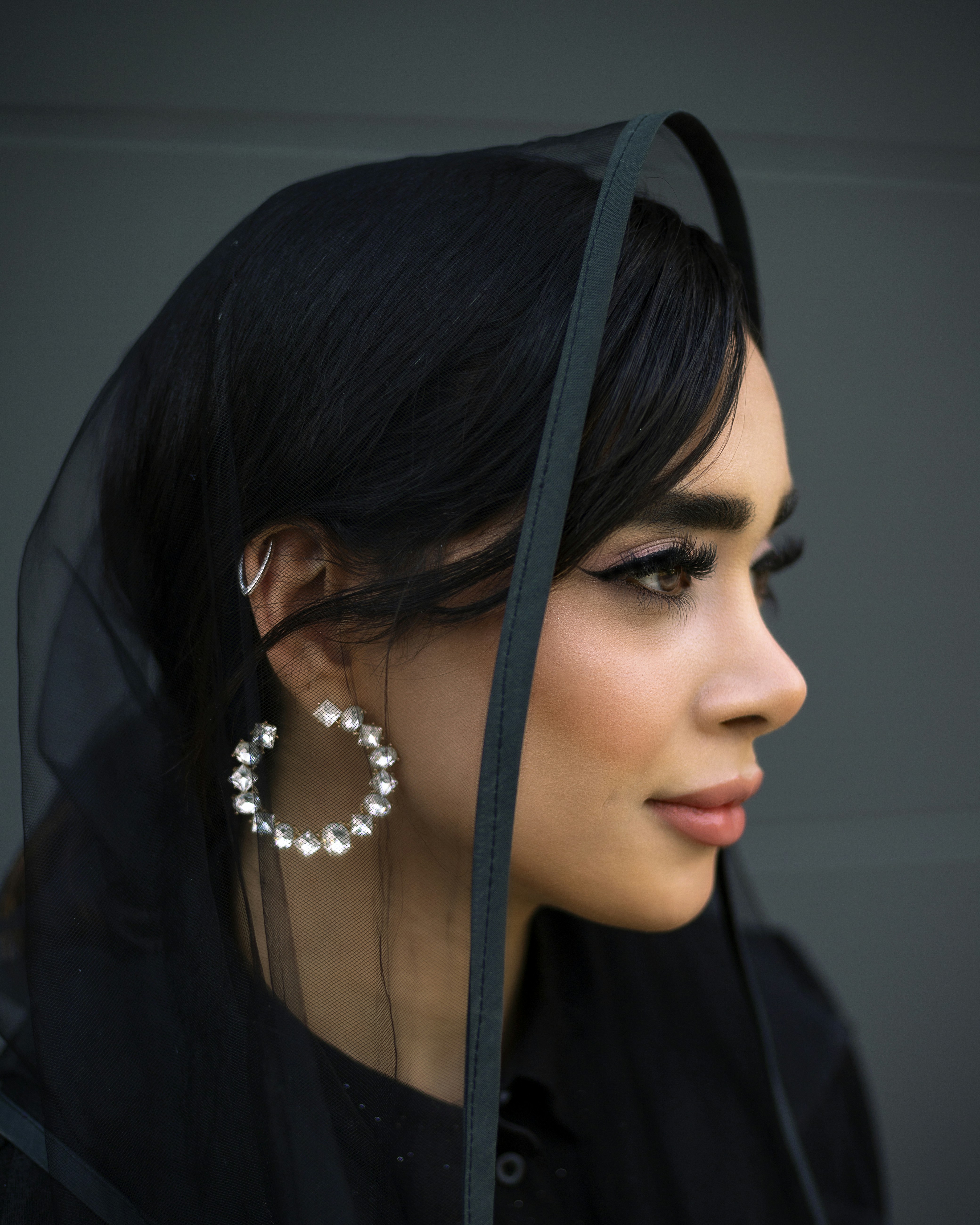 Gilded Gaze Through Velvet: A Portrait of Quiet Luminosity