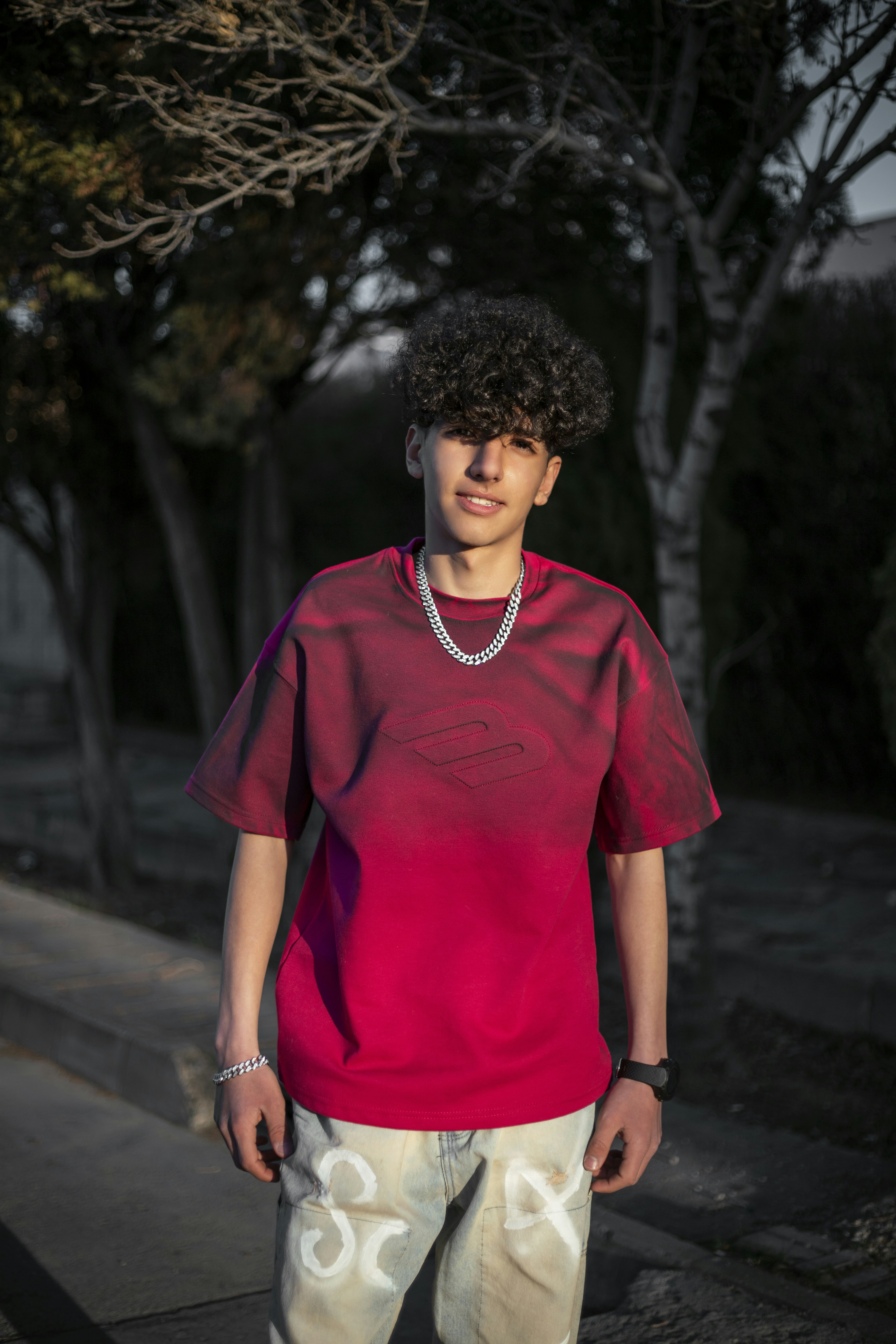 Crimson T-shirt Portrait Beneath Twilight Branches