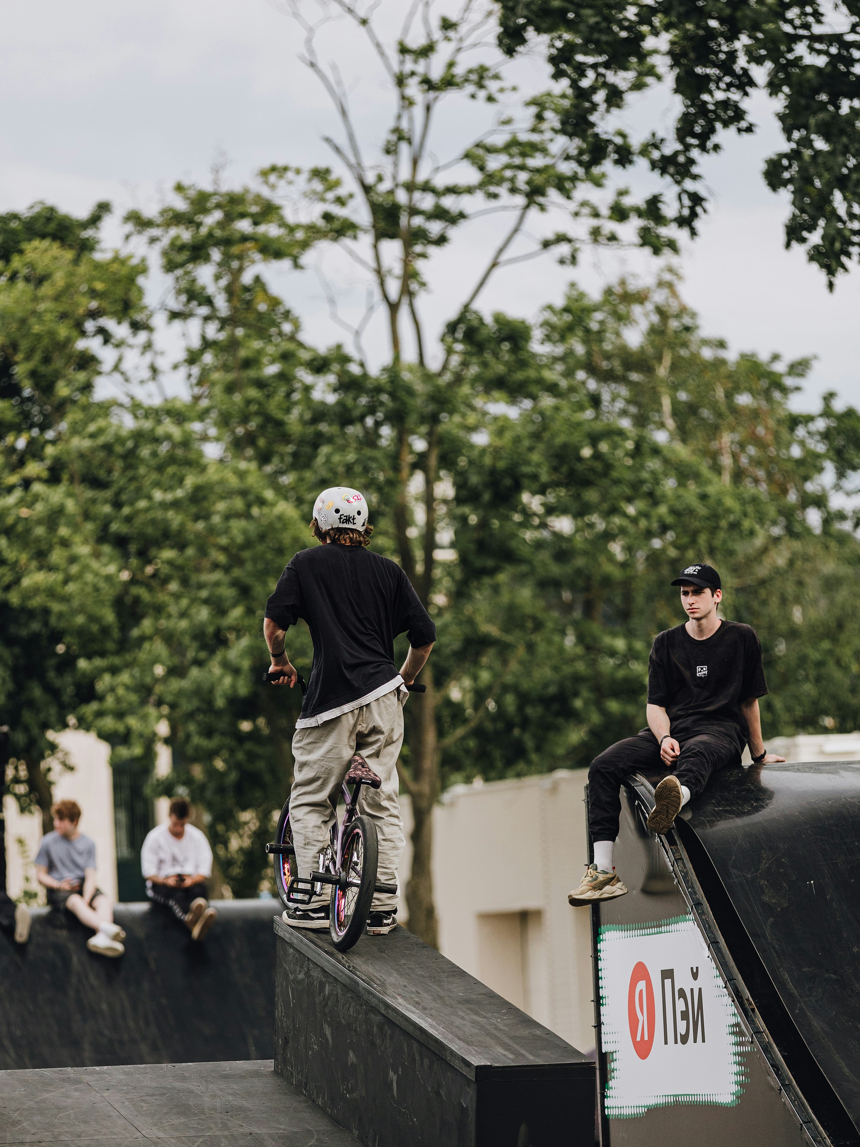 Bmx rider on ramp with spectators watching