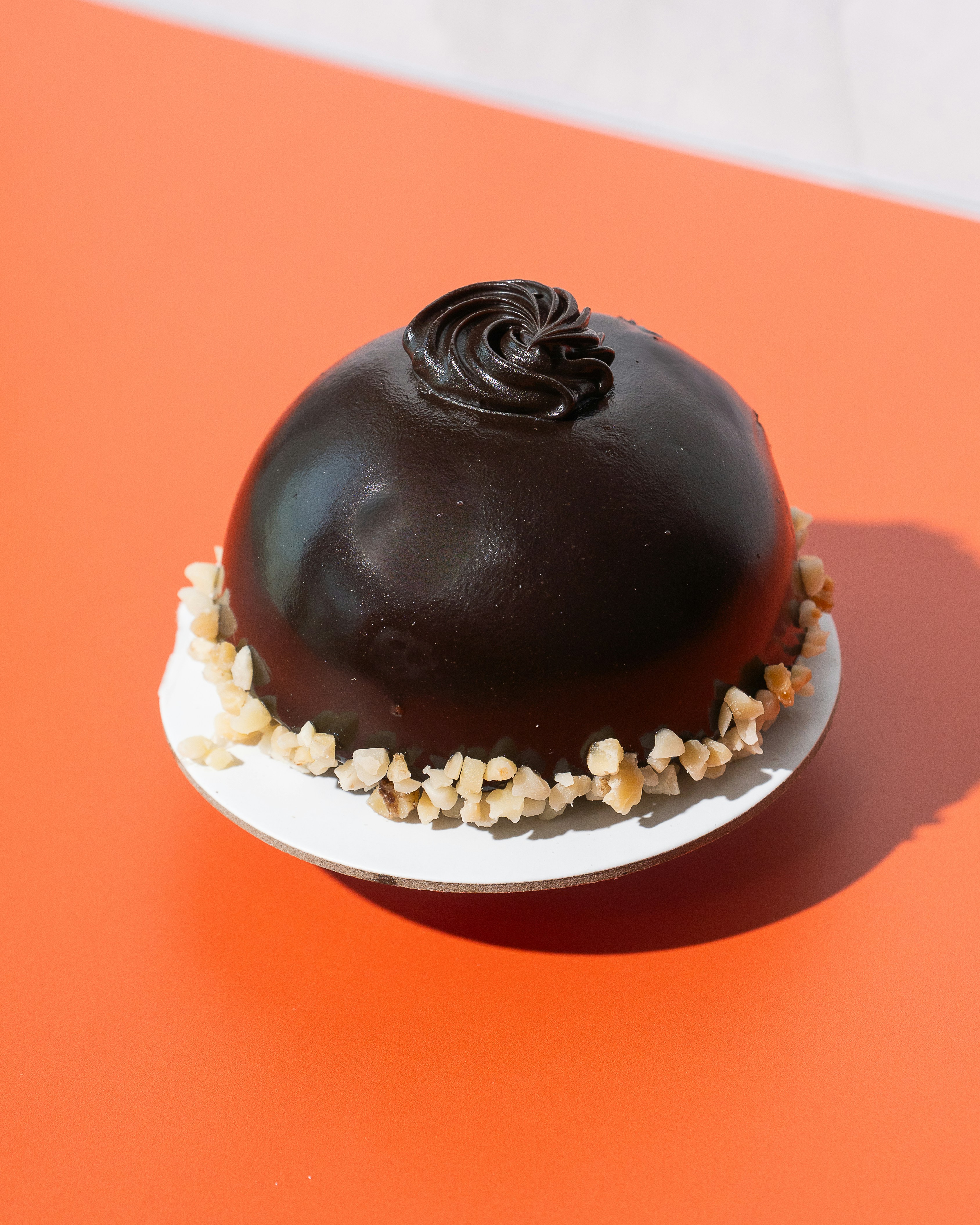 Glossy Chocolate Dome on a Nut-Crusted Base