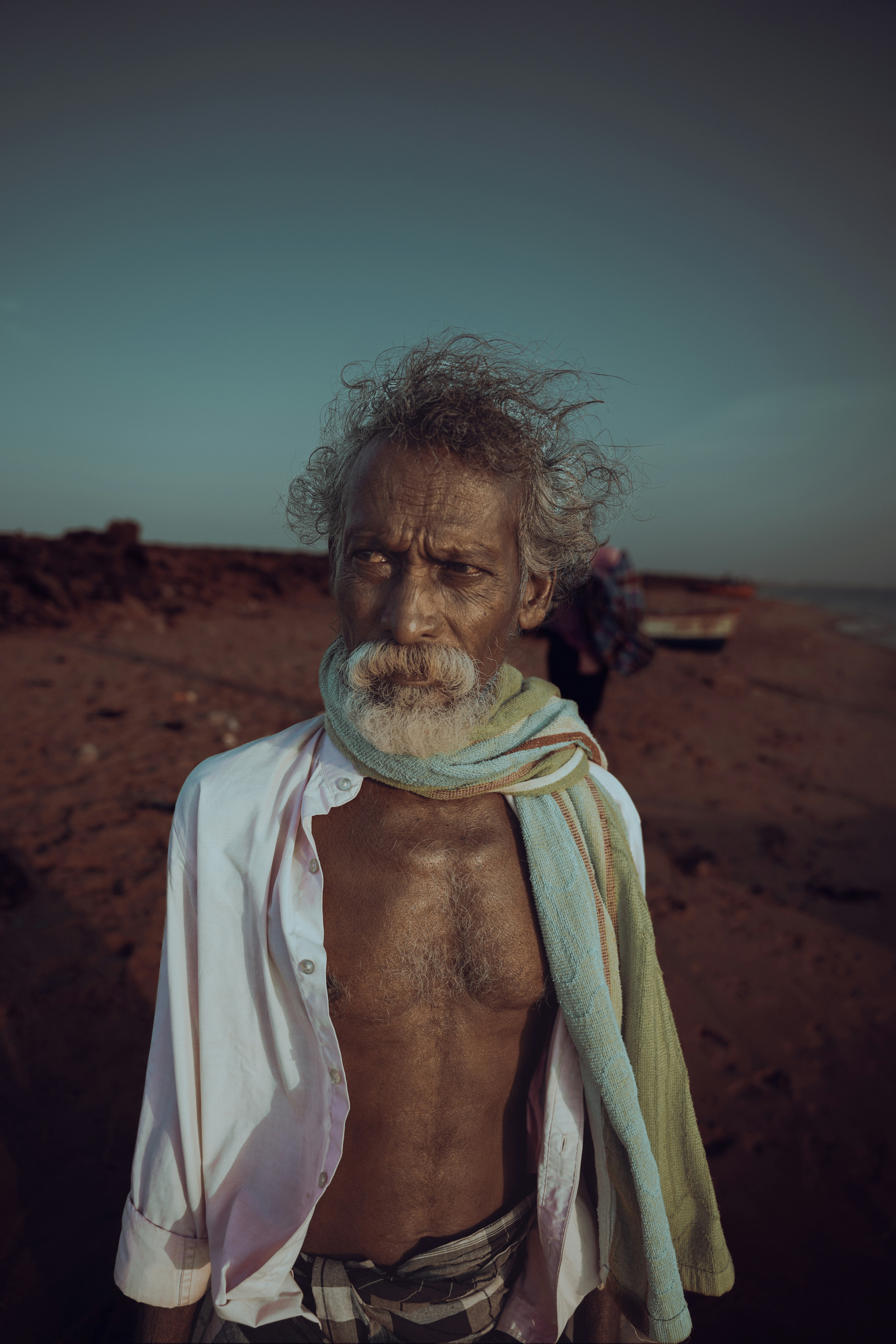 Photos taken during my motorbike tour to Dhanushkodi. | Elderly man with white beard and scarf on beach