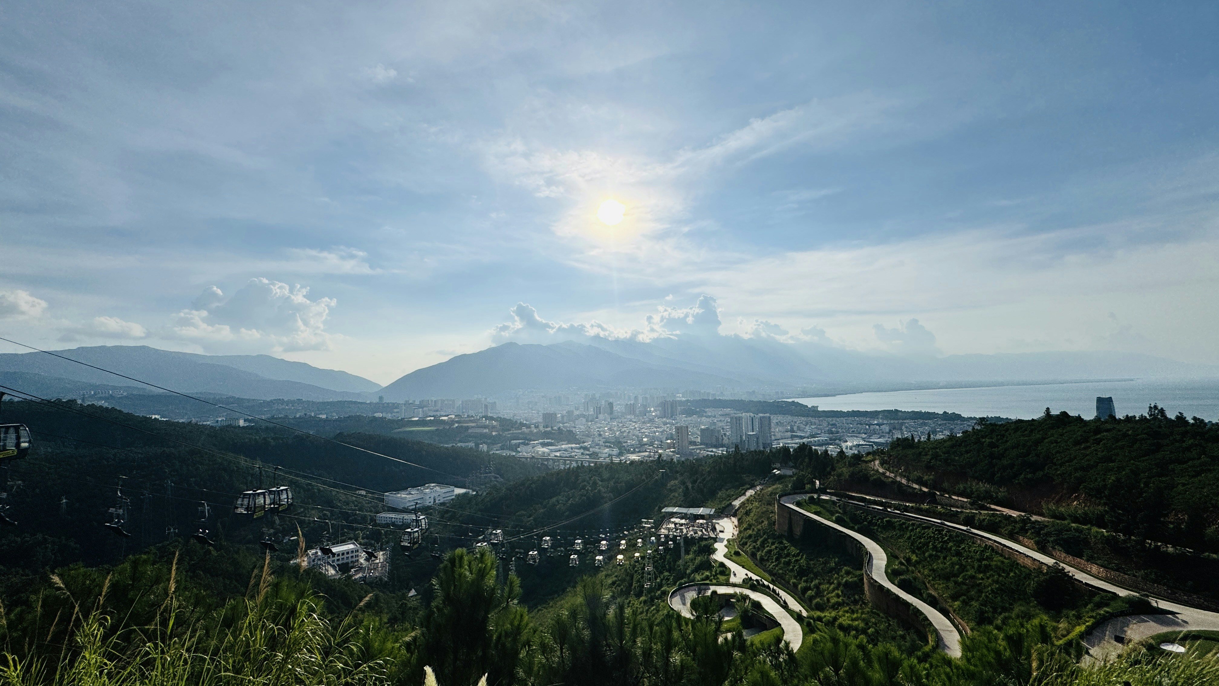 Sunlit Valley Overlook: A Twist of Roads Through Rolling Hills
